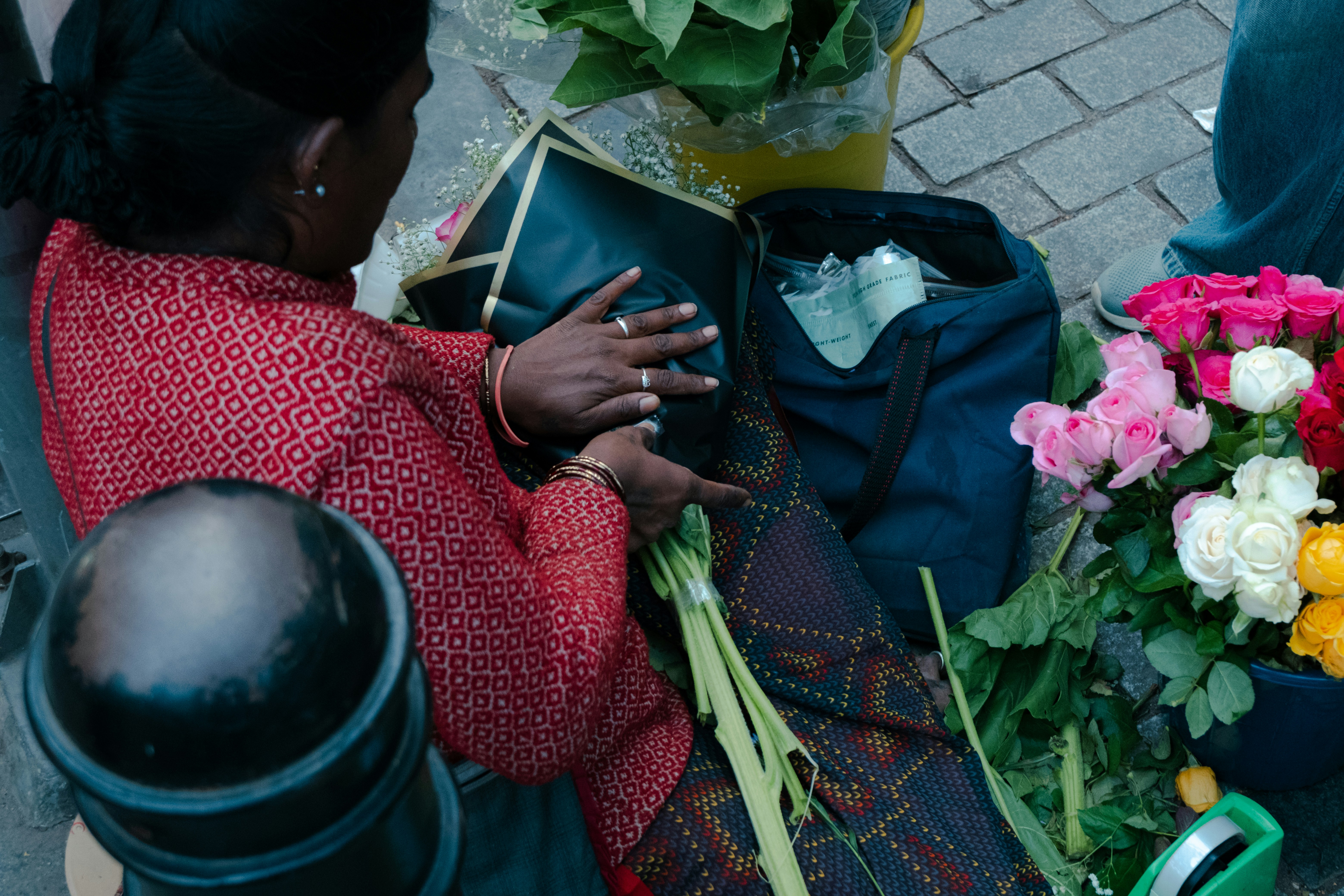 Gathering Amid Floral Trade: a Moment of Quiet Exchange