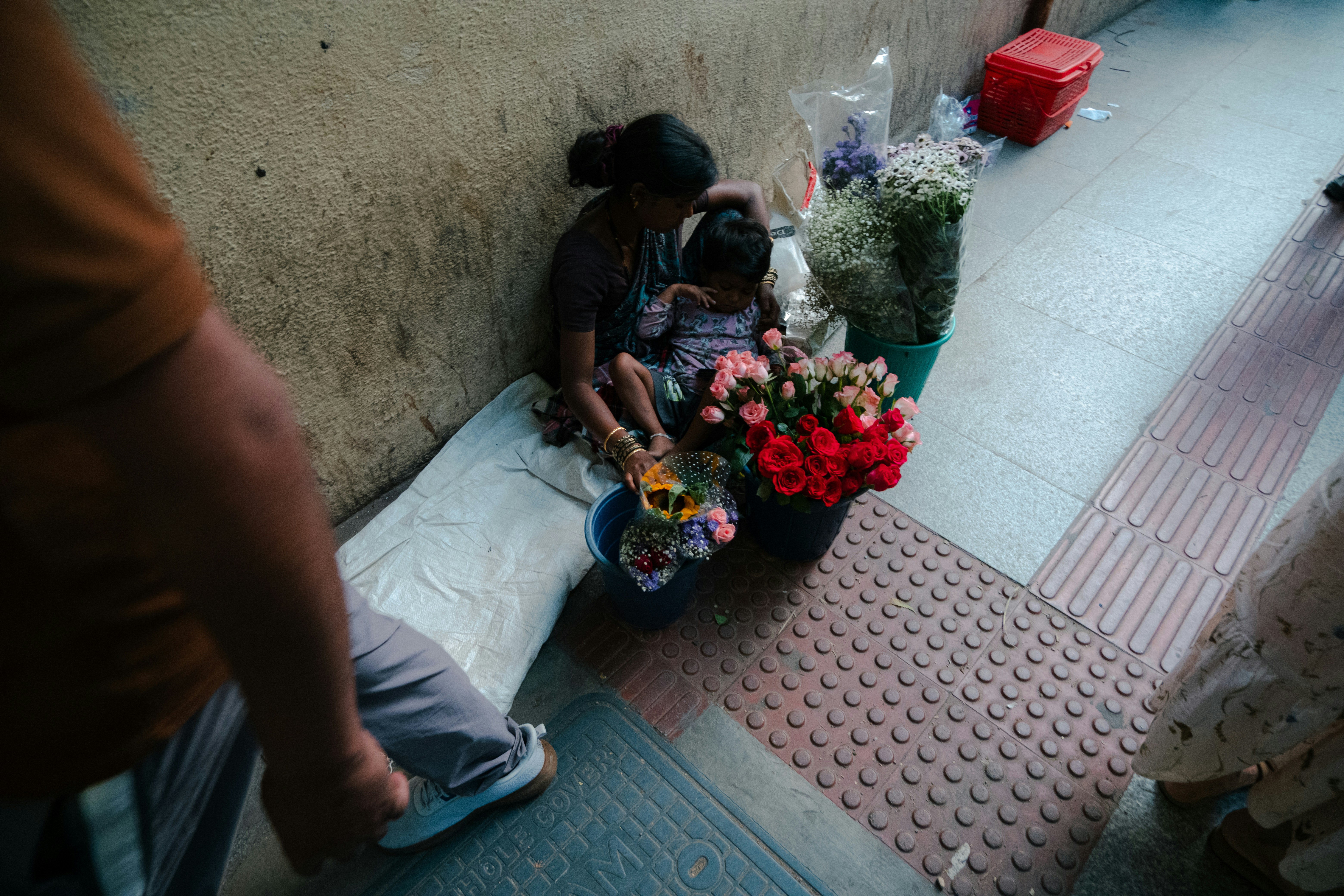 Street-side Flower Vendor with Child Watching