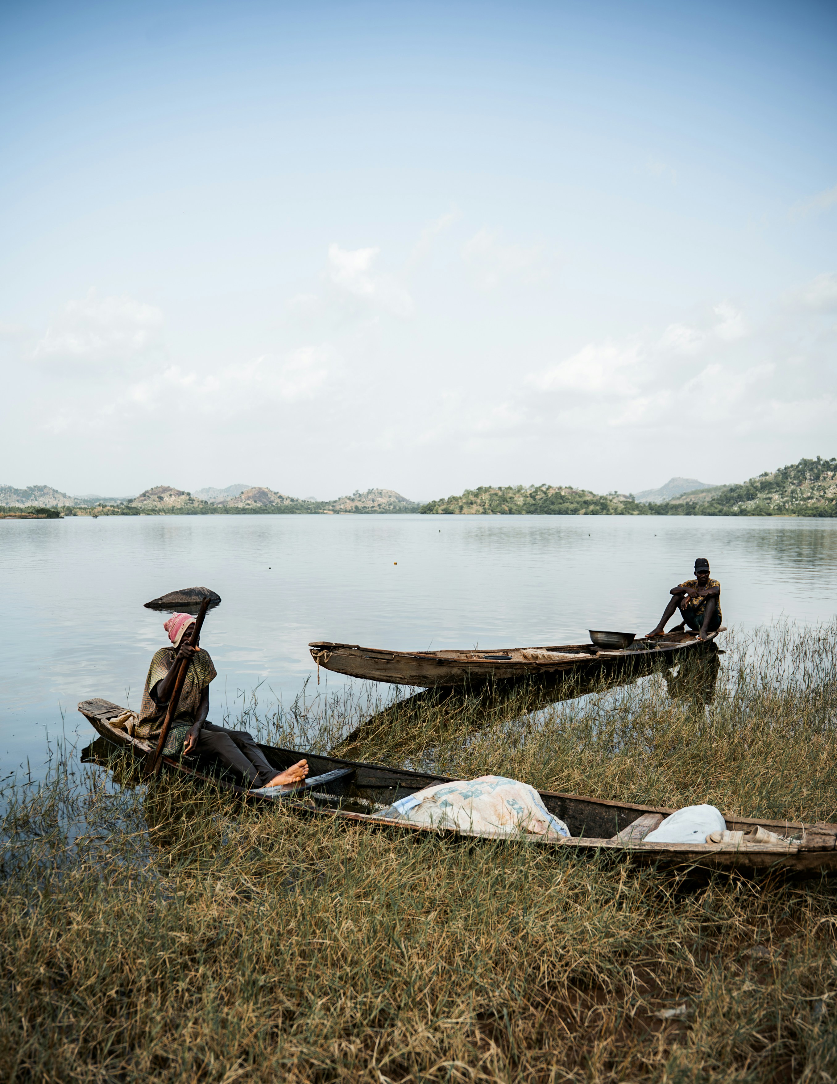 Dawn on the Still Lake: Boats Resting at the Shore