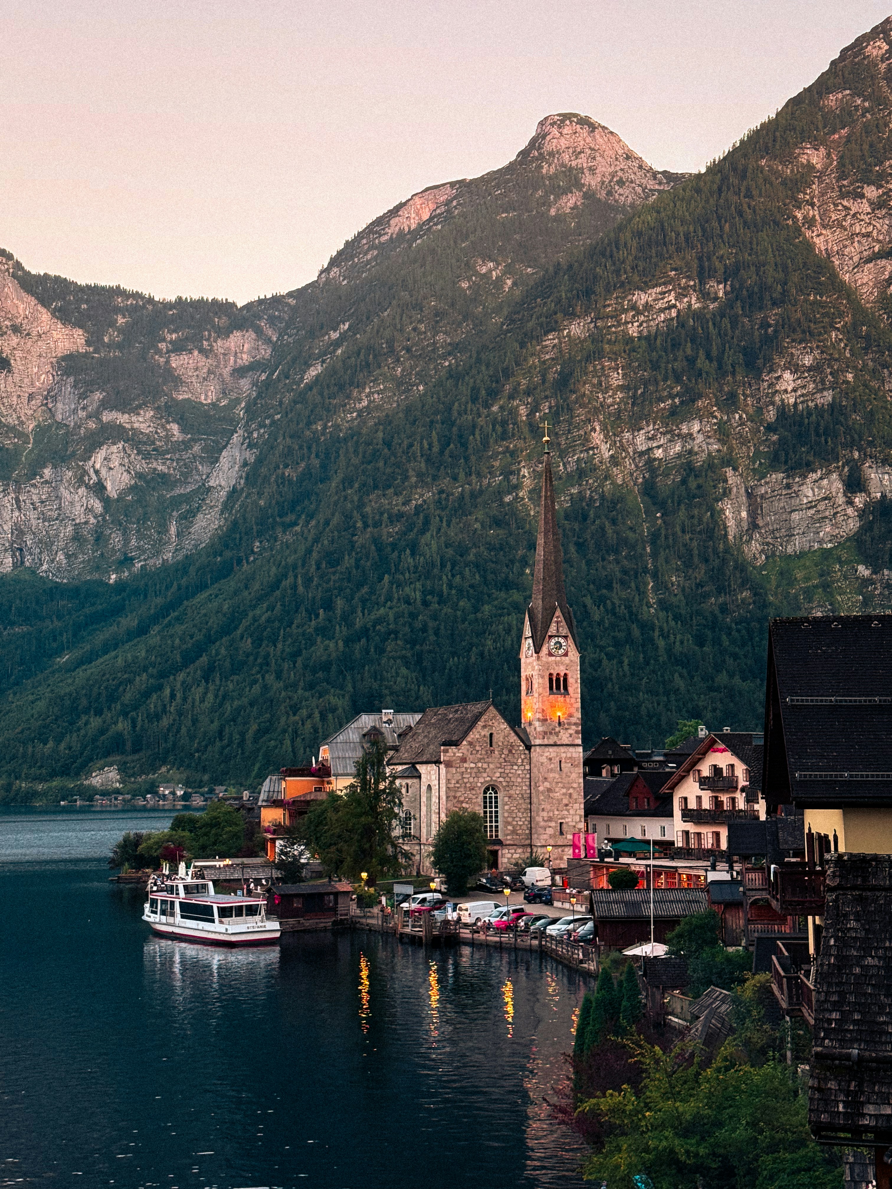 St. Michael’s Village Framed by Alpine Peaks at Dusk