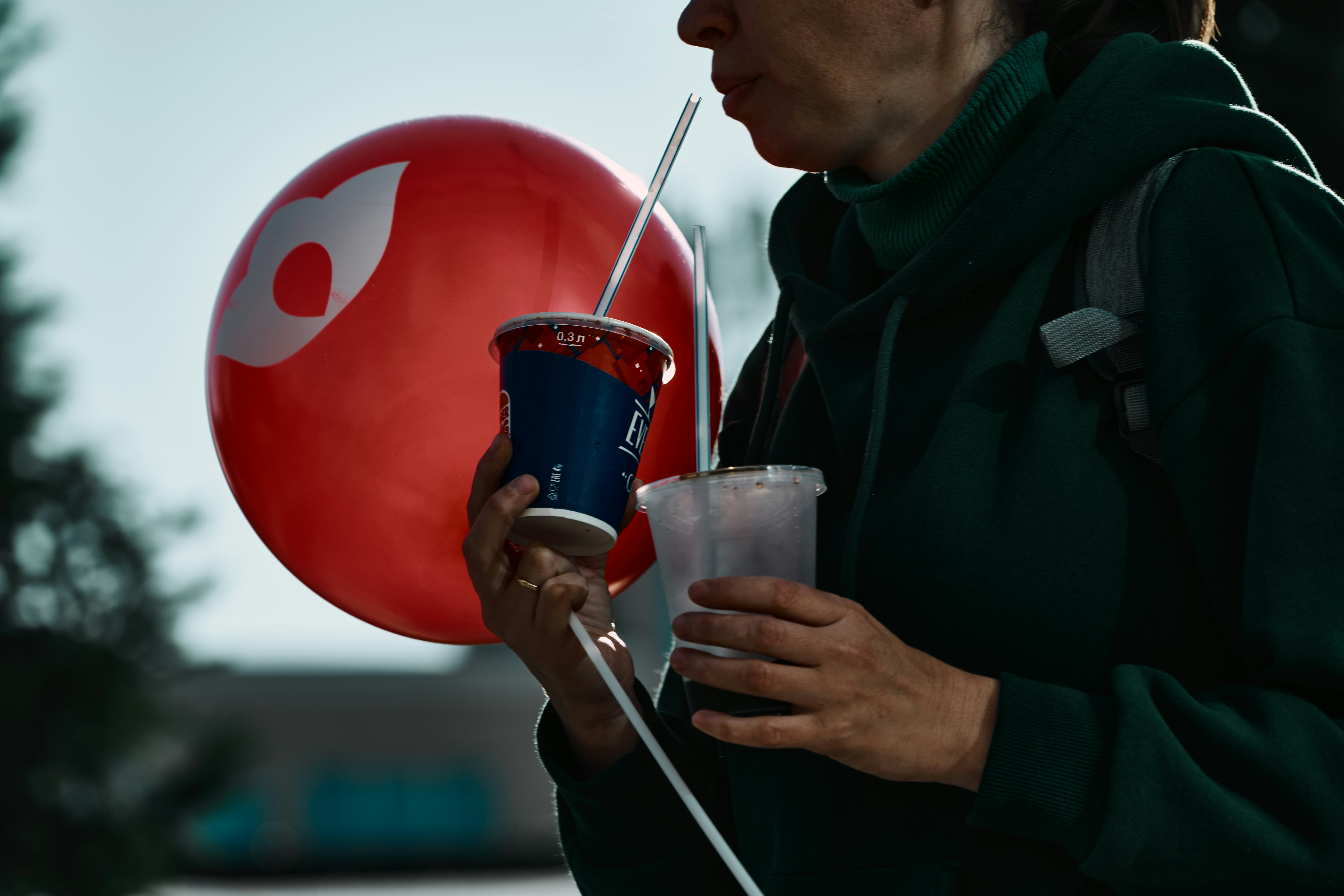 Mid-Afternoon Slurp: A Quiet Moment by the Balloon Oasis