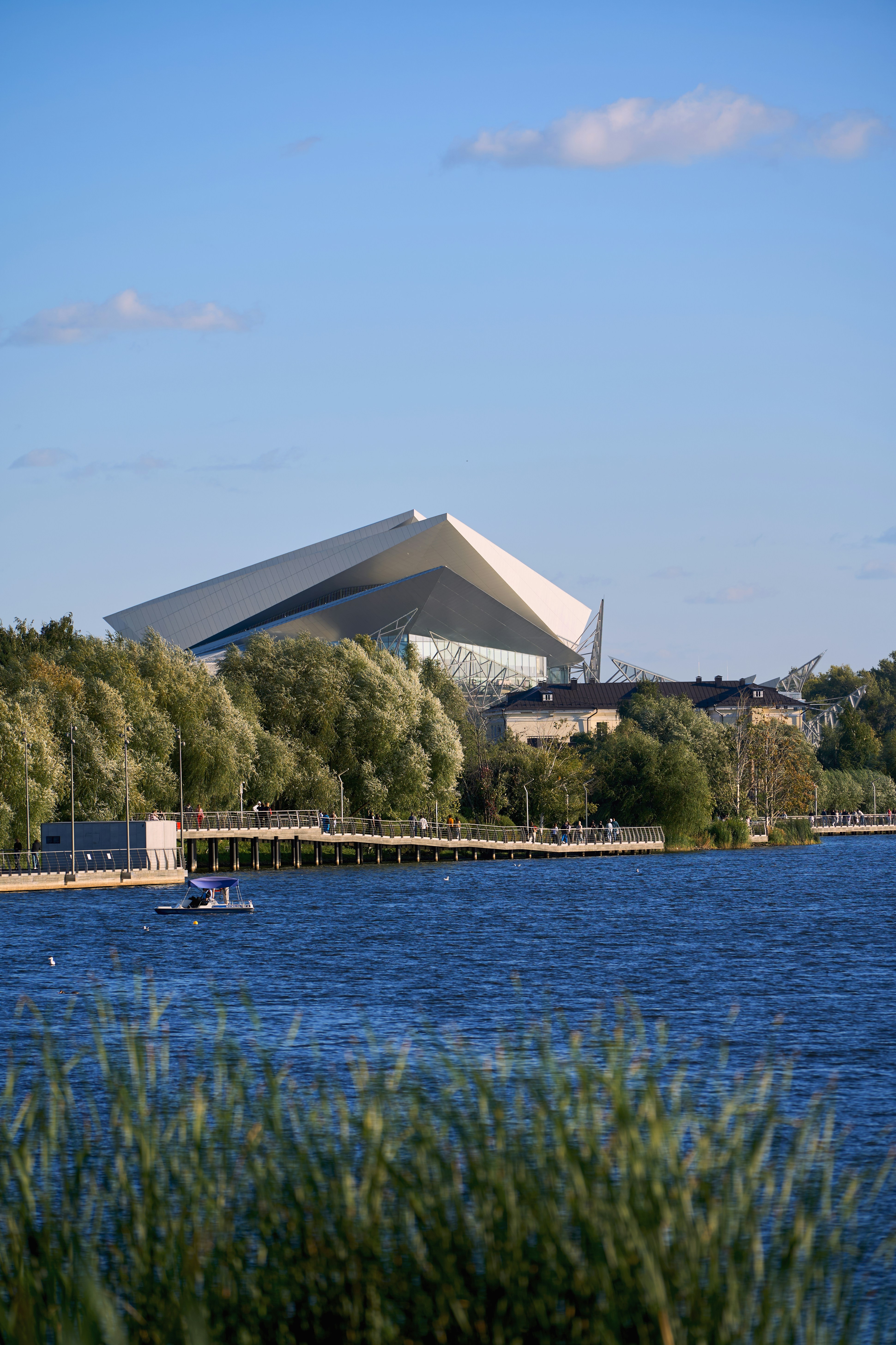 Architectural Banner by the River: A Modern Pavilion Rises Over the Water