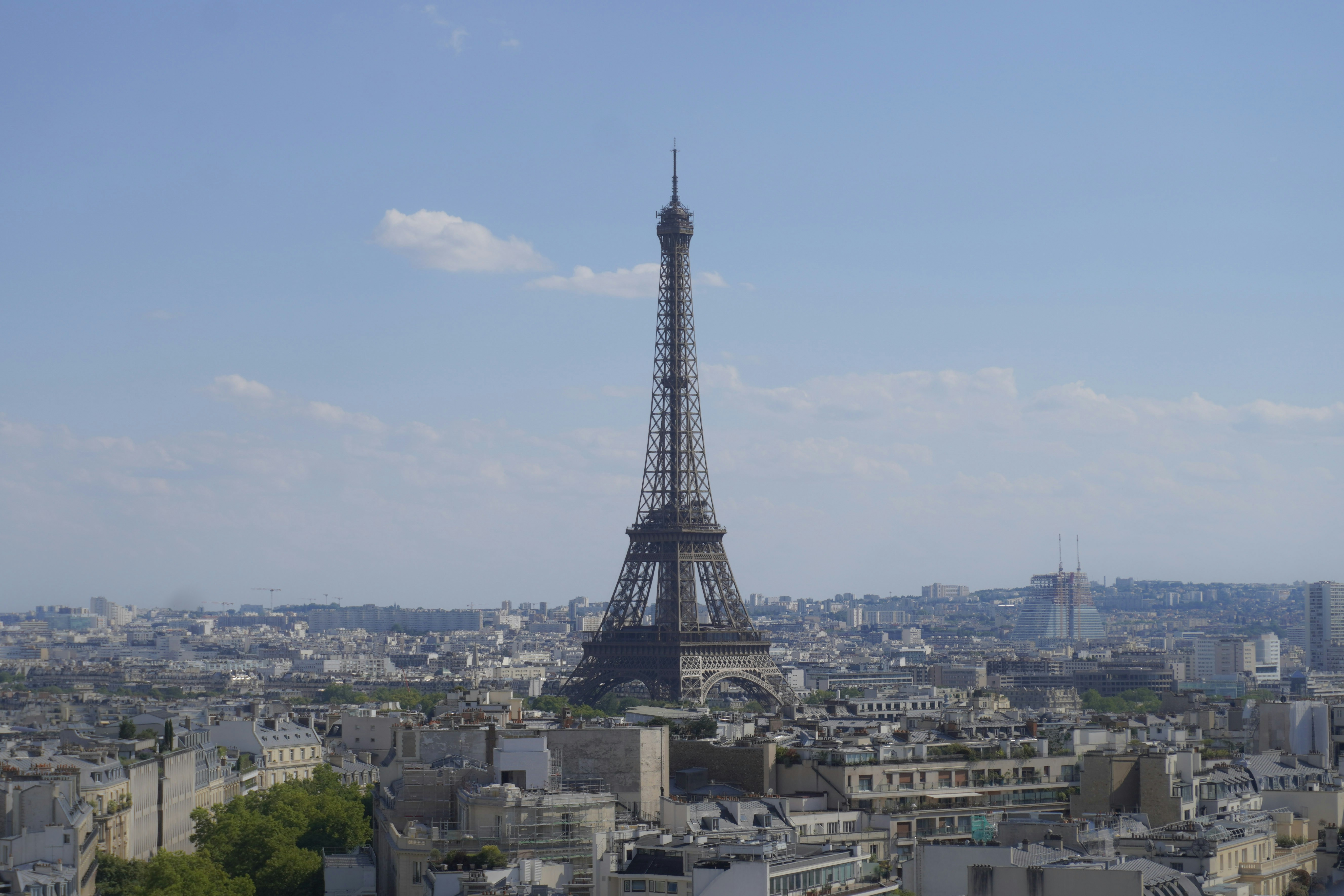 Paris in Focus: The Eiffel Tower Rising Above a Quiet Rooftop Sea