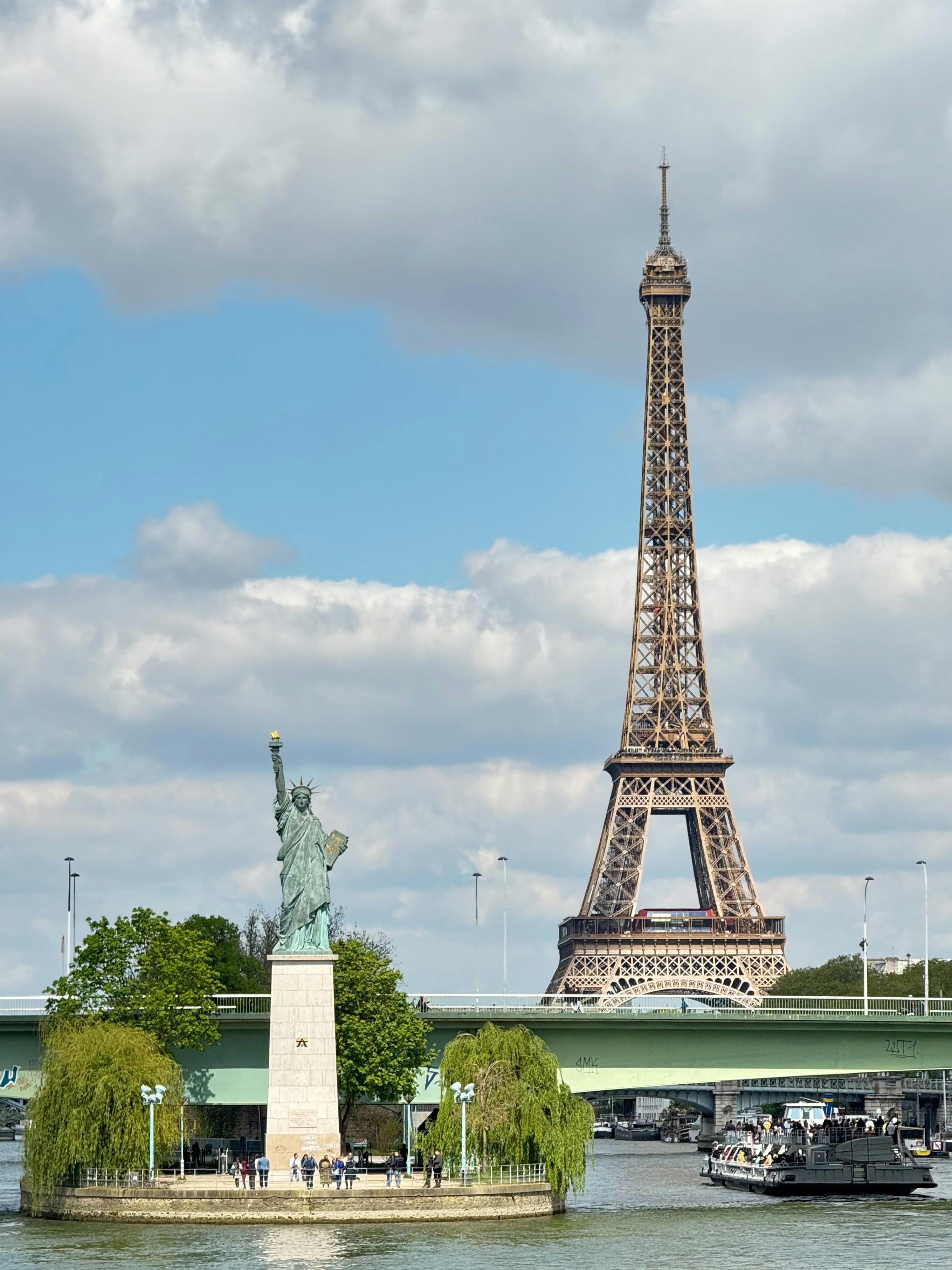 Parisian Skyline: Eiffel Tower Rising Over the River with a Statue of Liberty Replica Island
