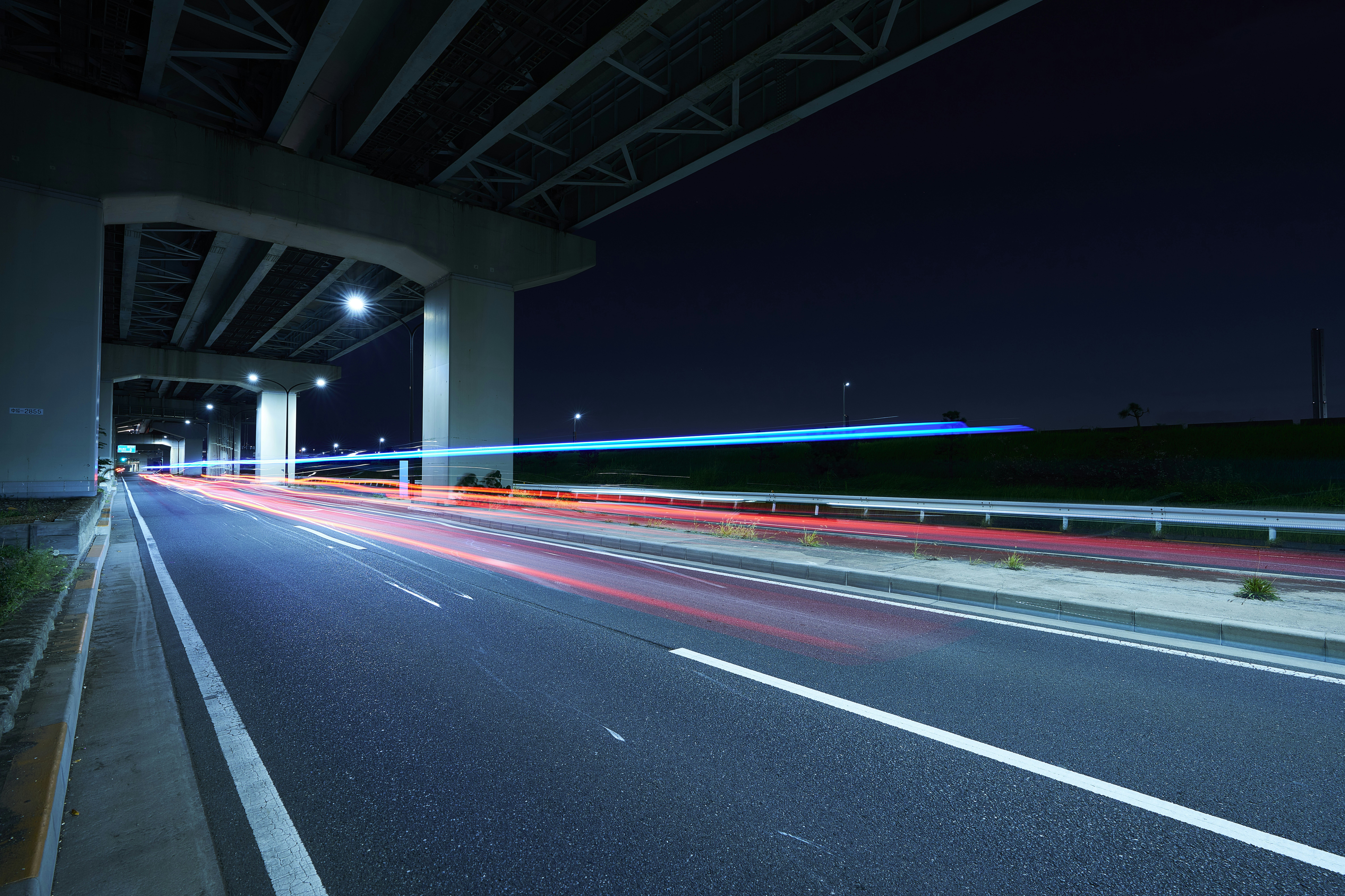 Night Underpass: Streaks of Light along an Empty Highway