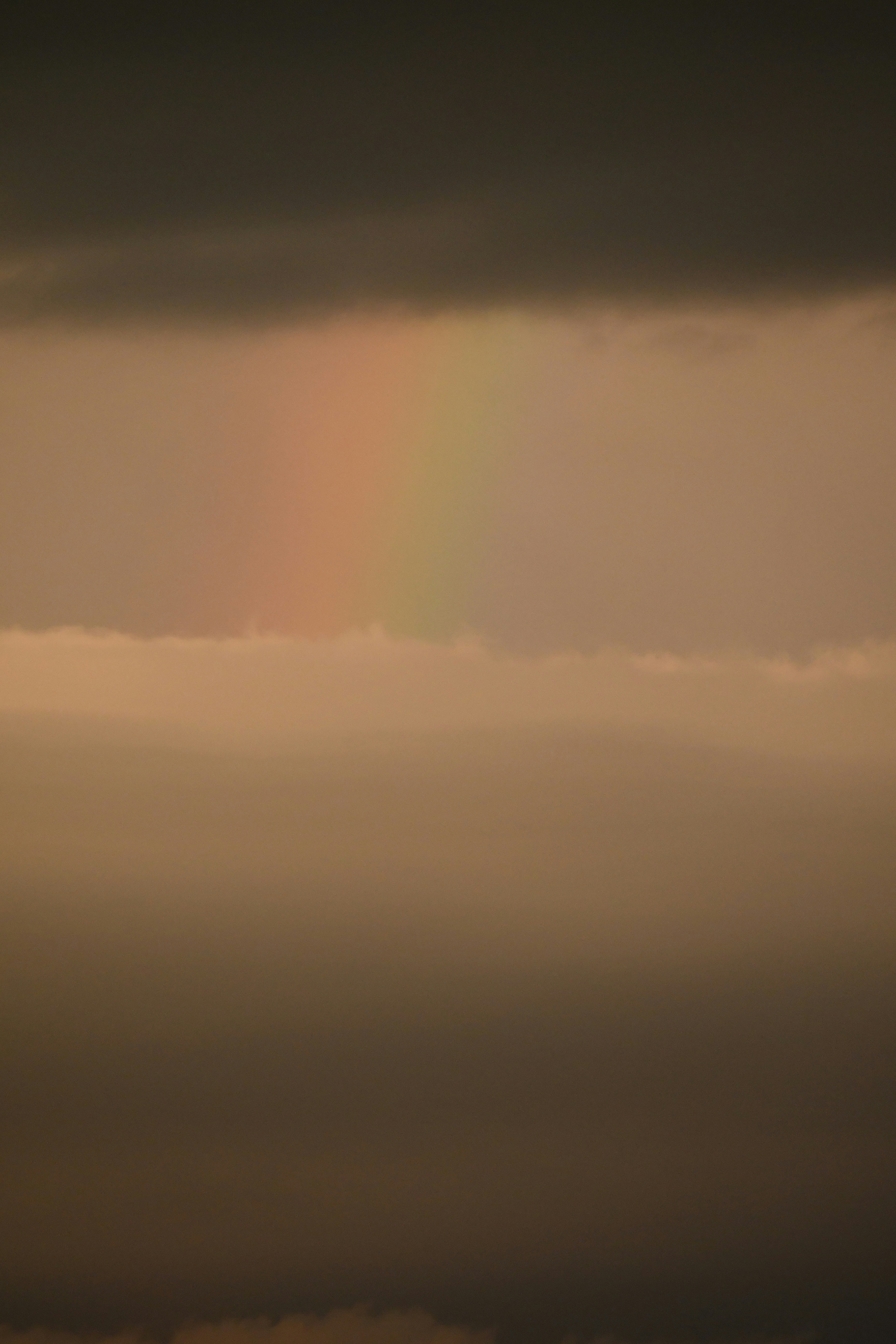 Soft Golden Arc: A Gentle Rainbow in Quiet Skies