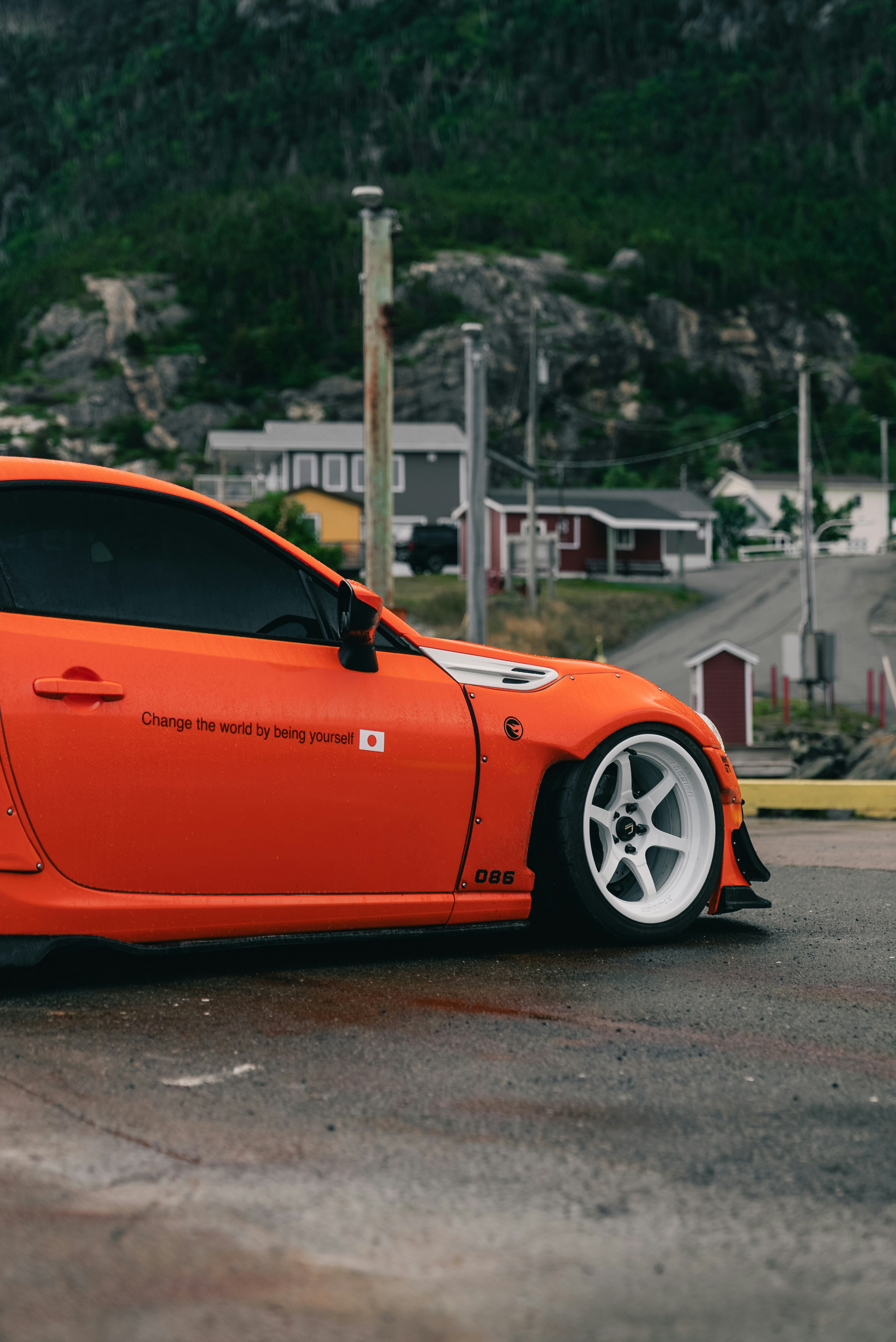 Orange Streak: A Low-Angle Glimpse of a Pro Street Car