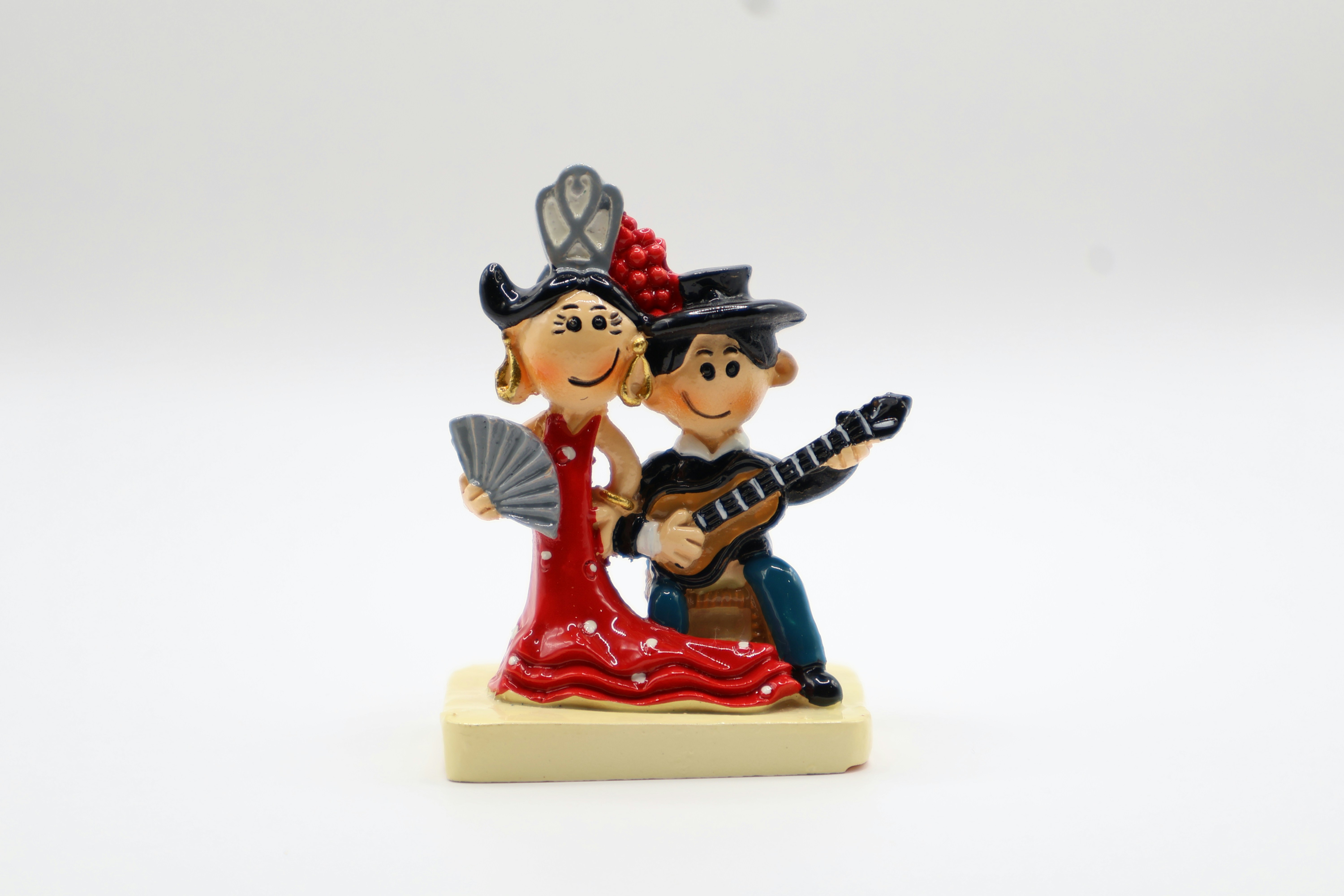 Figurines in Cozy Spotlight: A Duo of Song and Dance