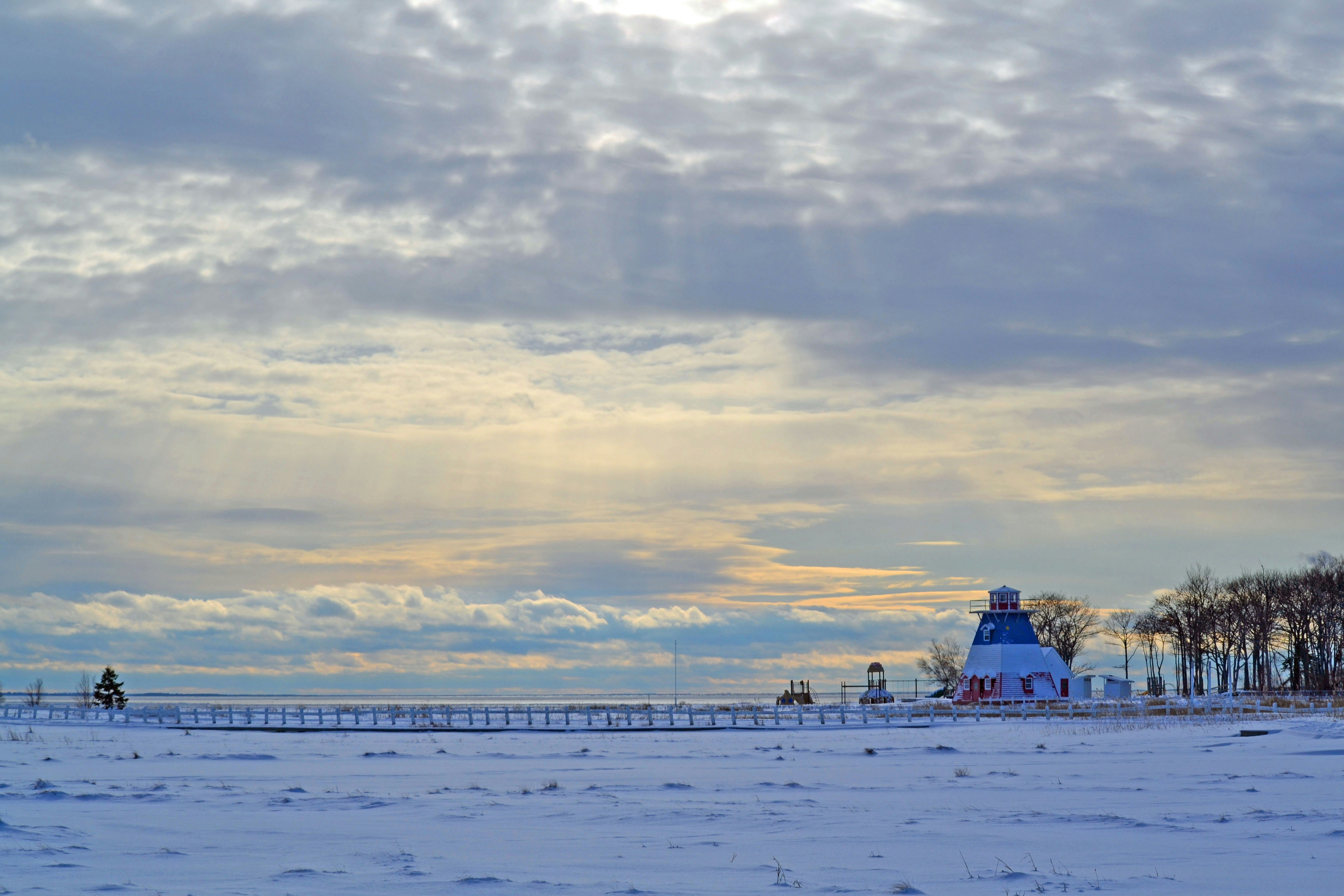 Silhouette of a Snowbound House Under a Quiet Winter Sky