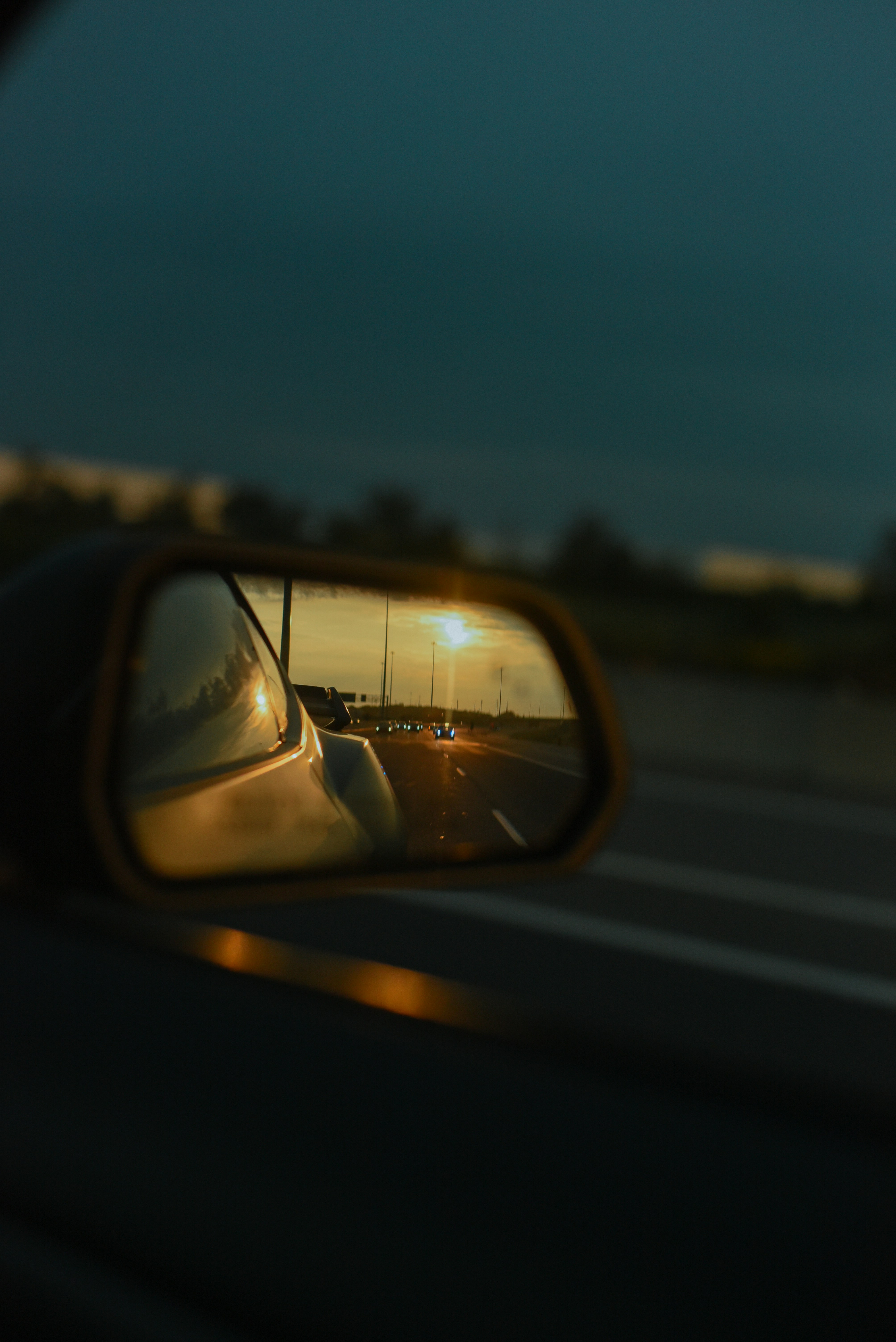 Rear-view Echo: Sunset in the Mirror