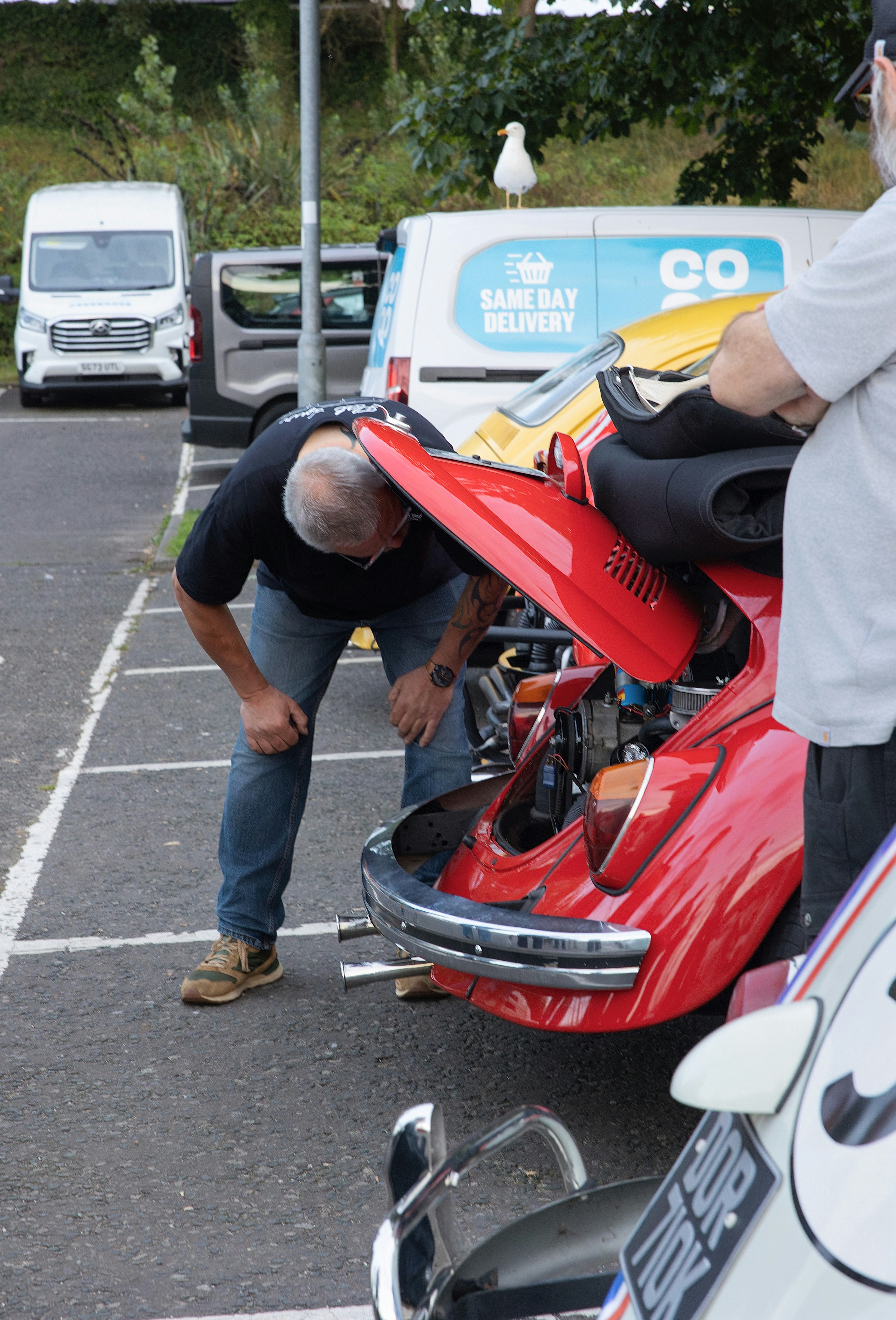 Mechanic at Work: A Red Motorcycle in the Workshop Light
