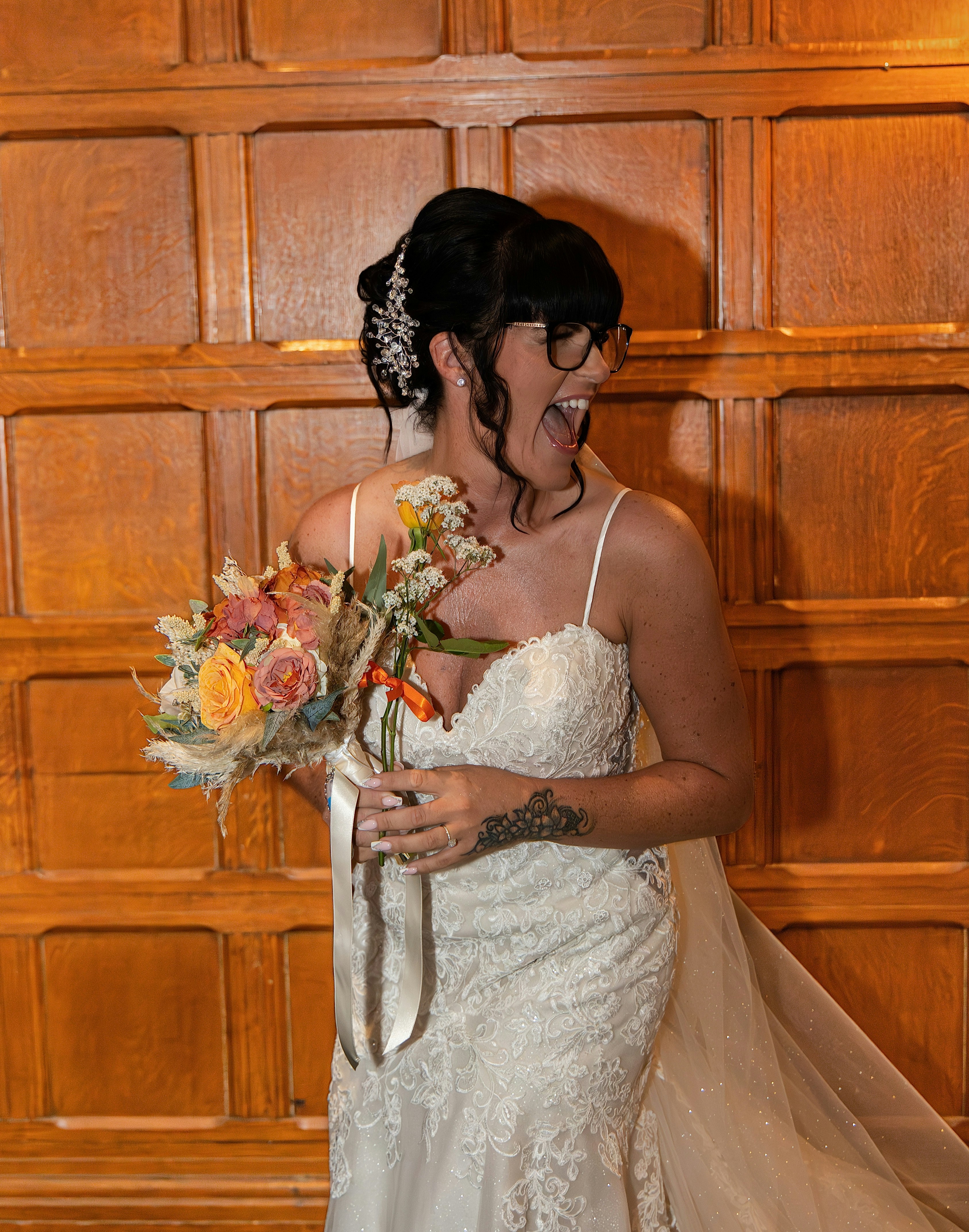 Joy in White Lace: A Bride's Burst of Laughter with Bouquets