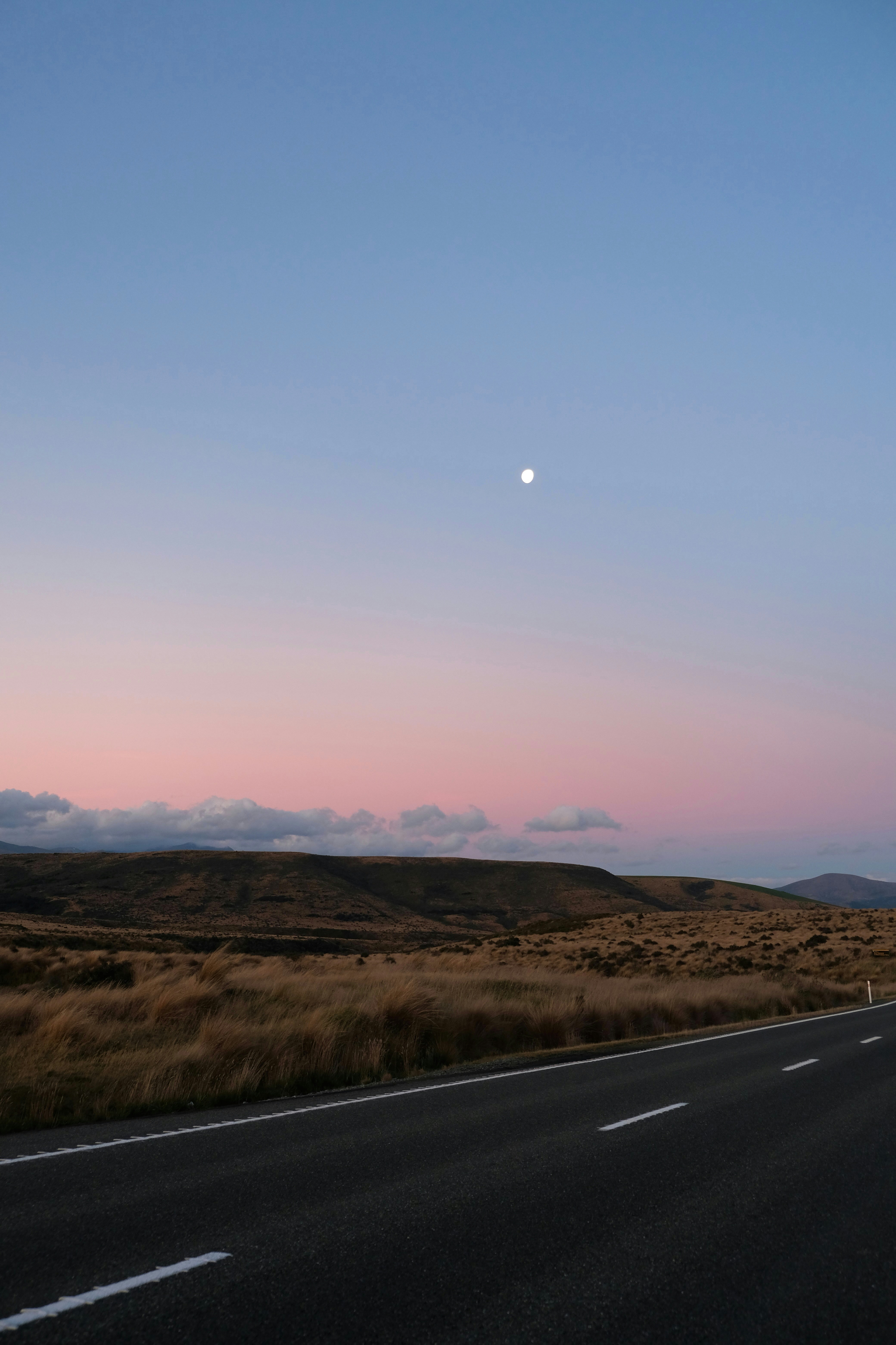 Pastel Horizon: Moon Over the Open Road