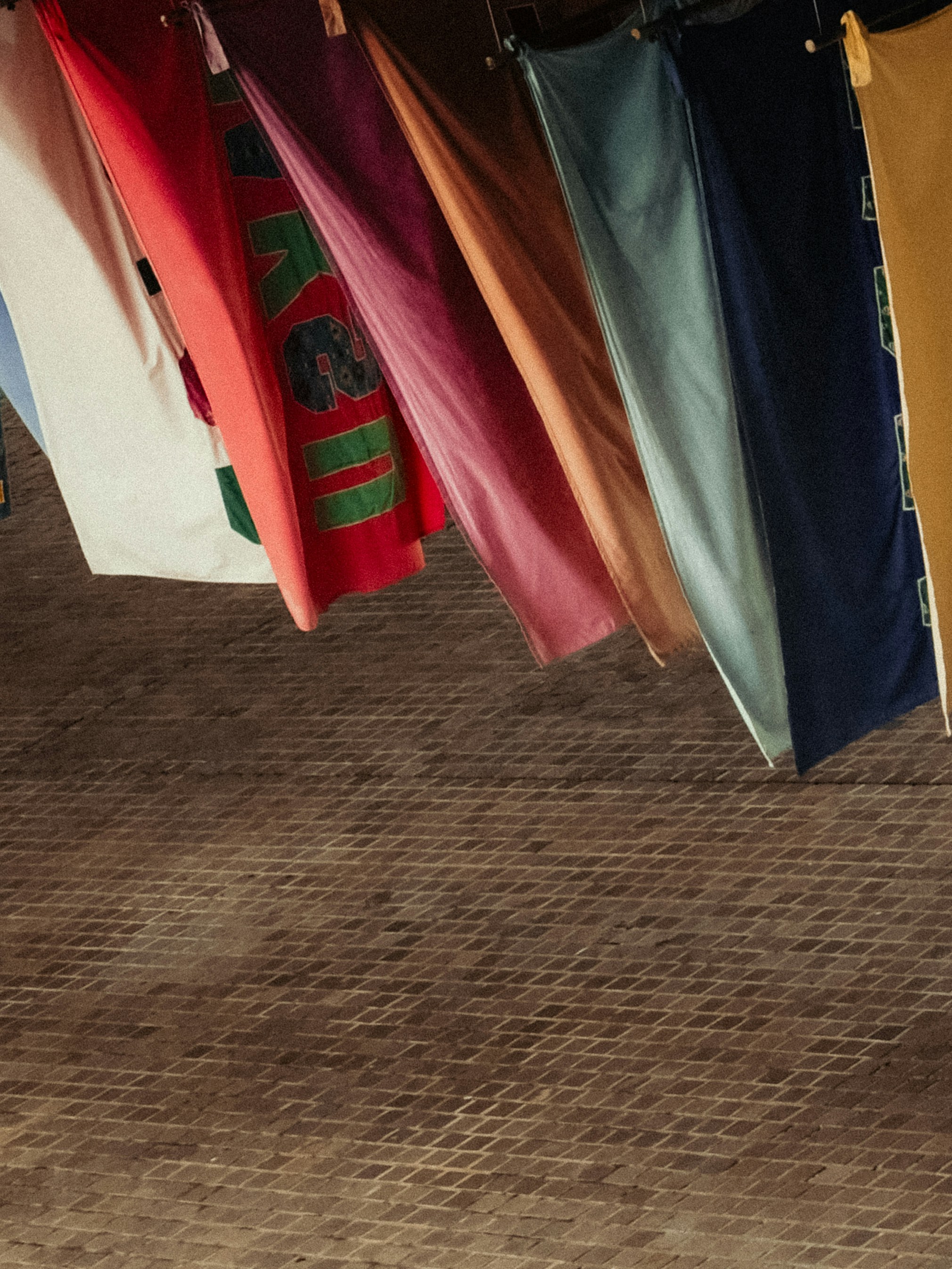 Colorful Garment Slabs Draped Over a Wooden Floor