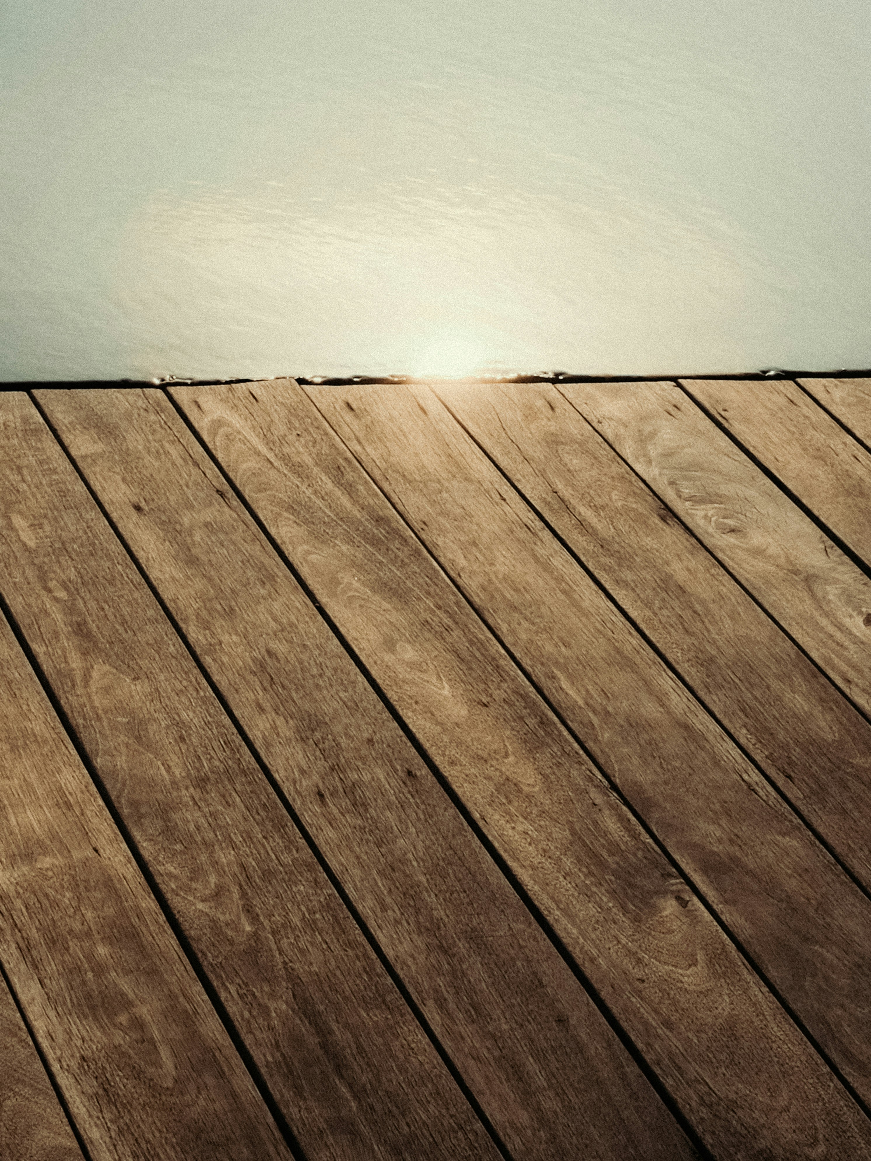 Morning Light on Weathered Boards by the Quiet Shore