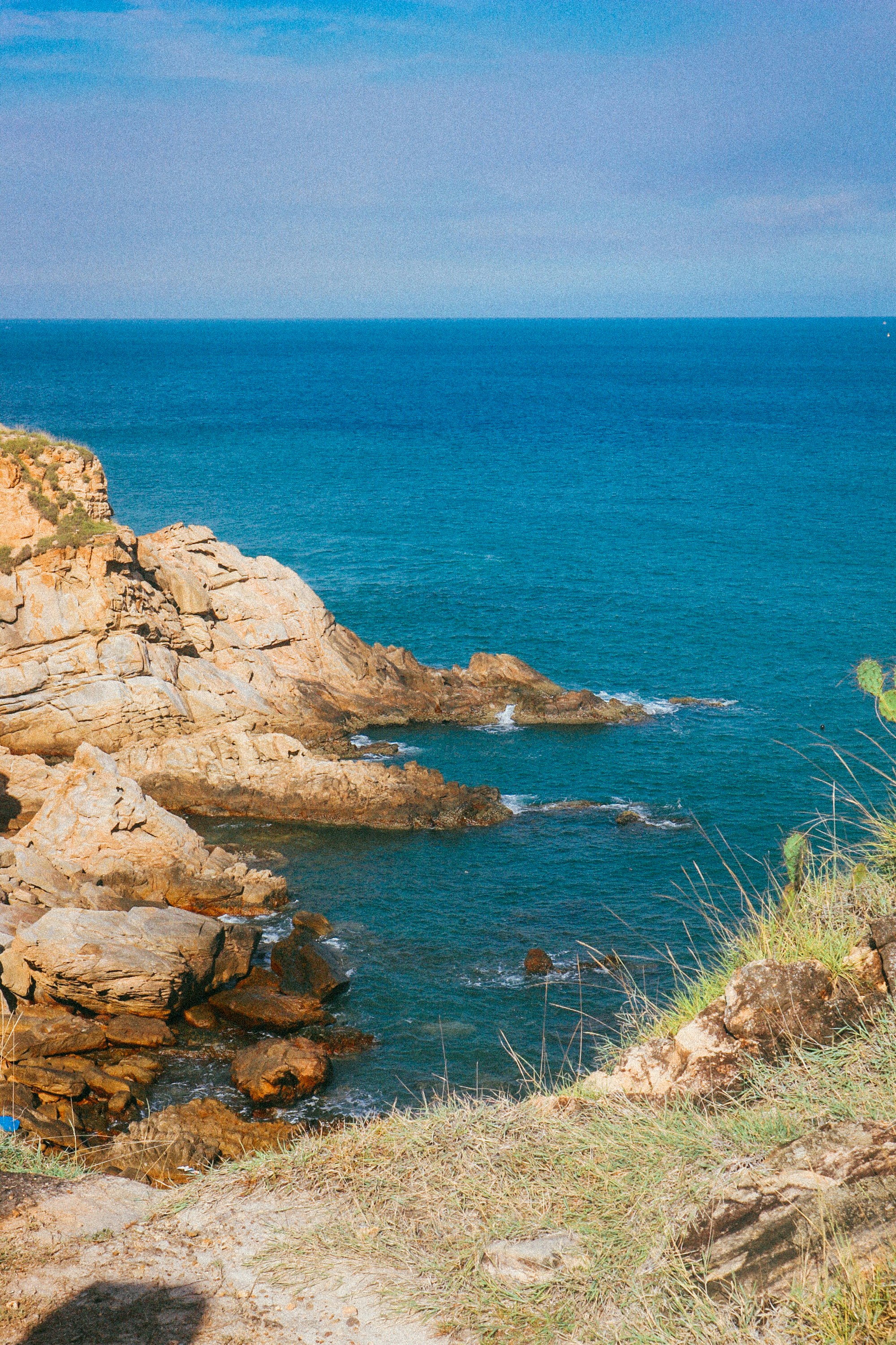 Cliffside Dawn Over Turquoise Seas