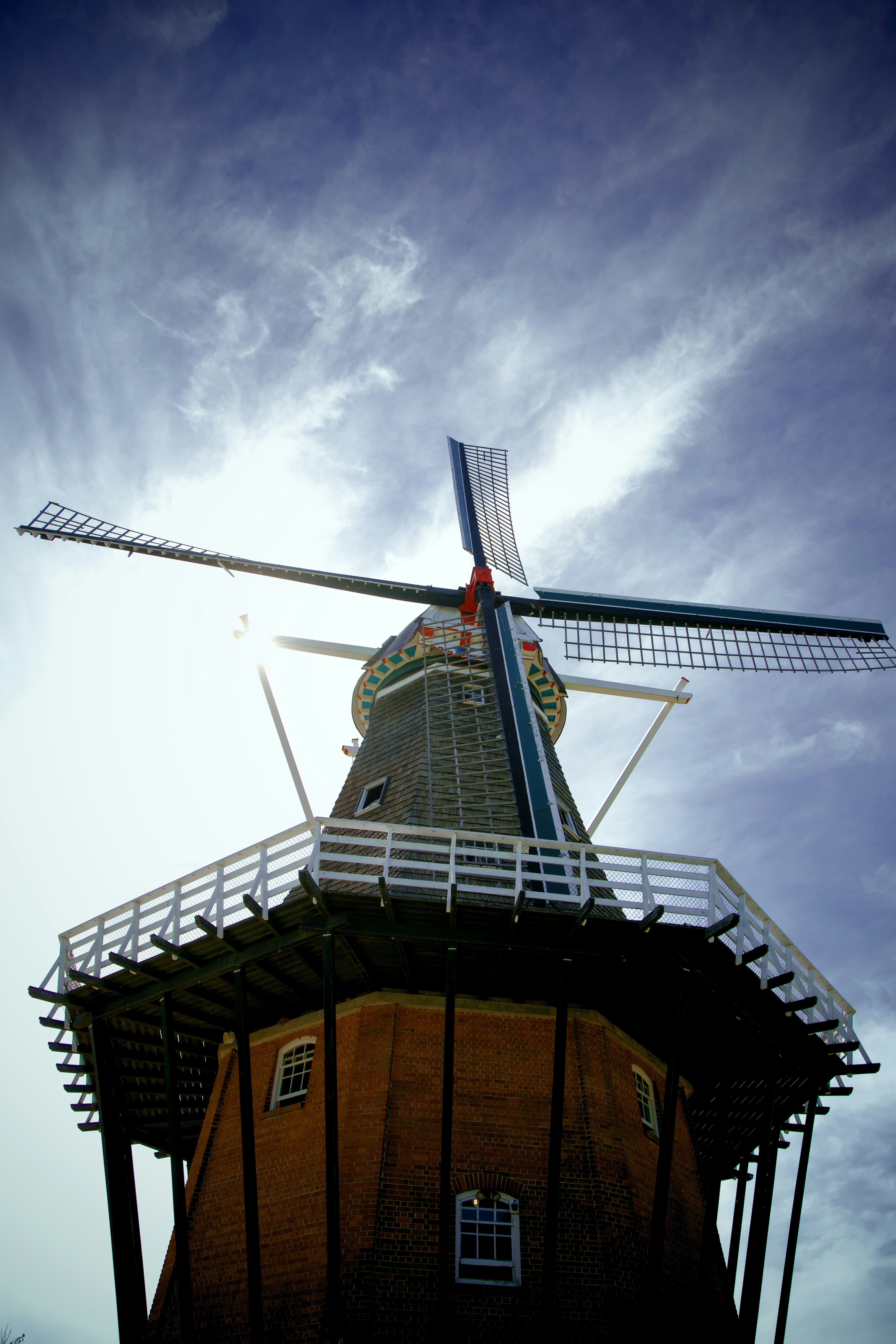 Sunlit Windmill: A Dutch Classic Rising into a Cerulean Sky