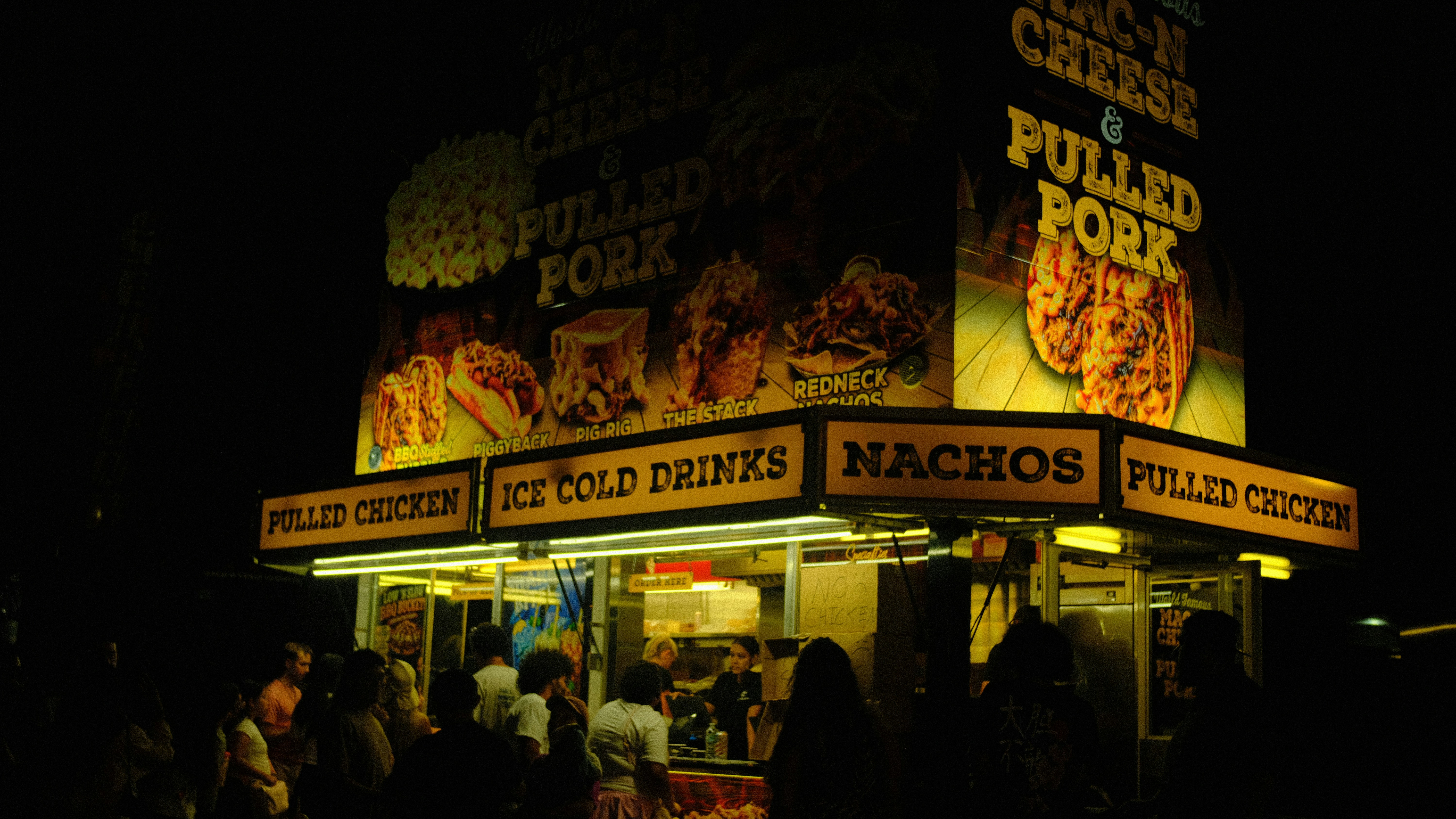 Night Food Stand: Neon Lights and Steam at a Vendor Window