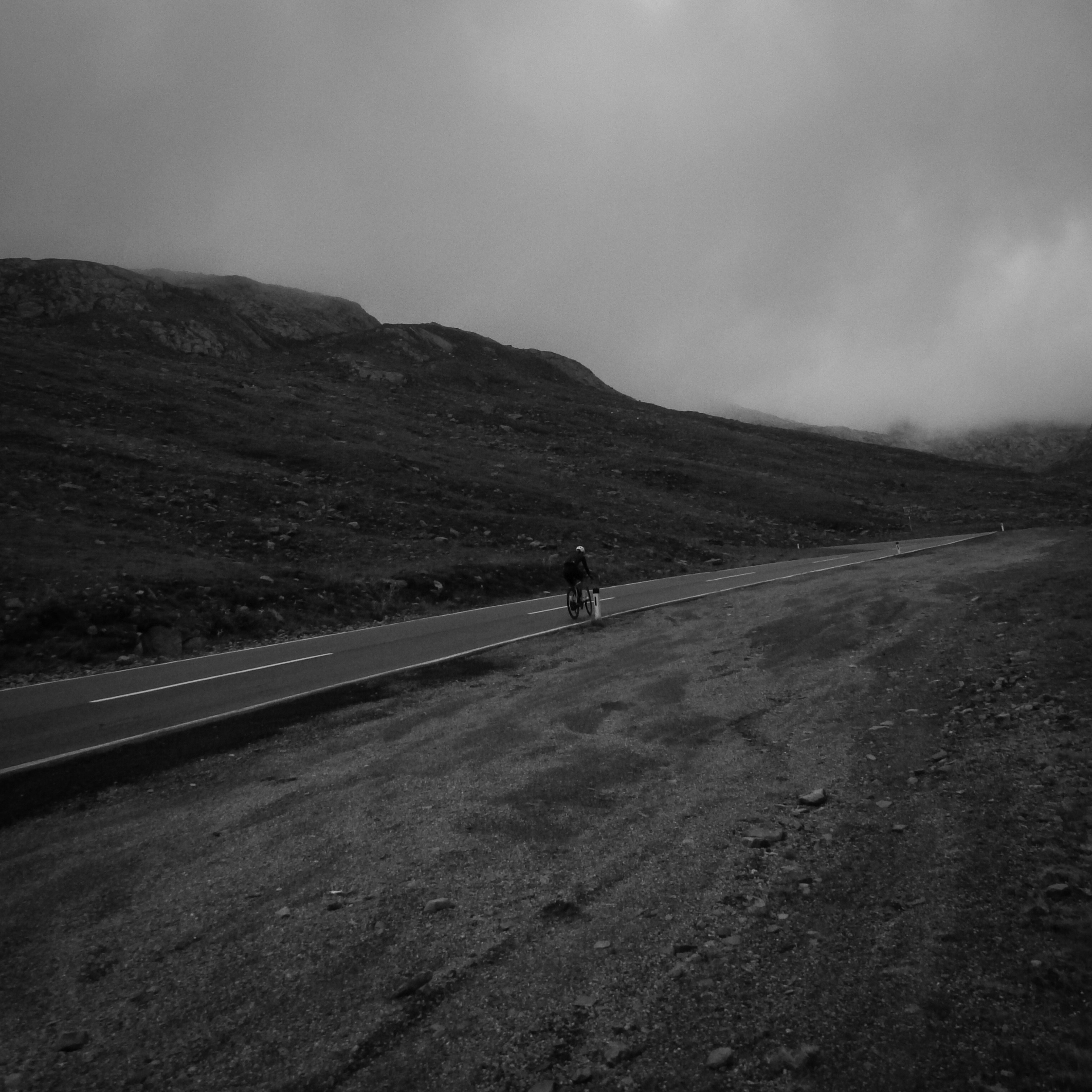 Deserted Highway Beneath a Looming Sky