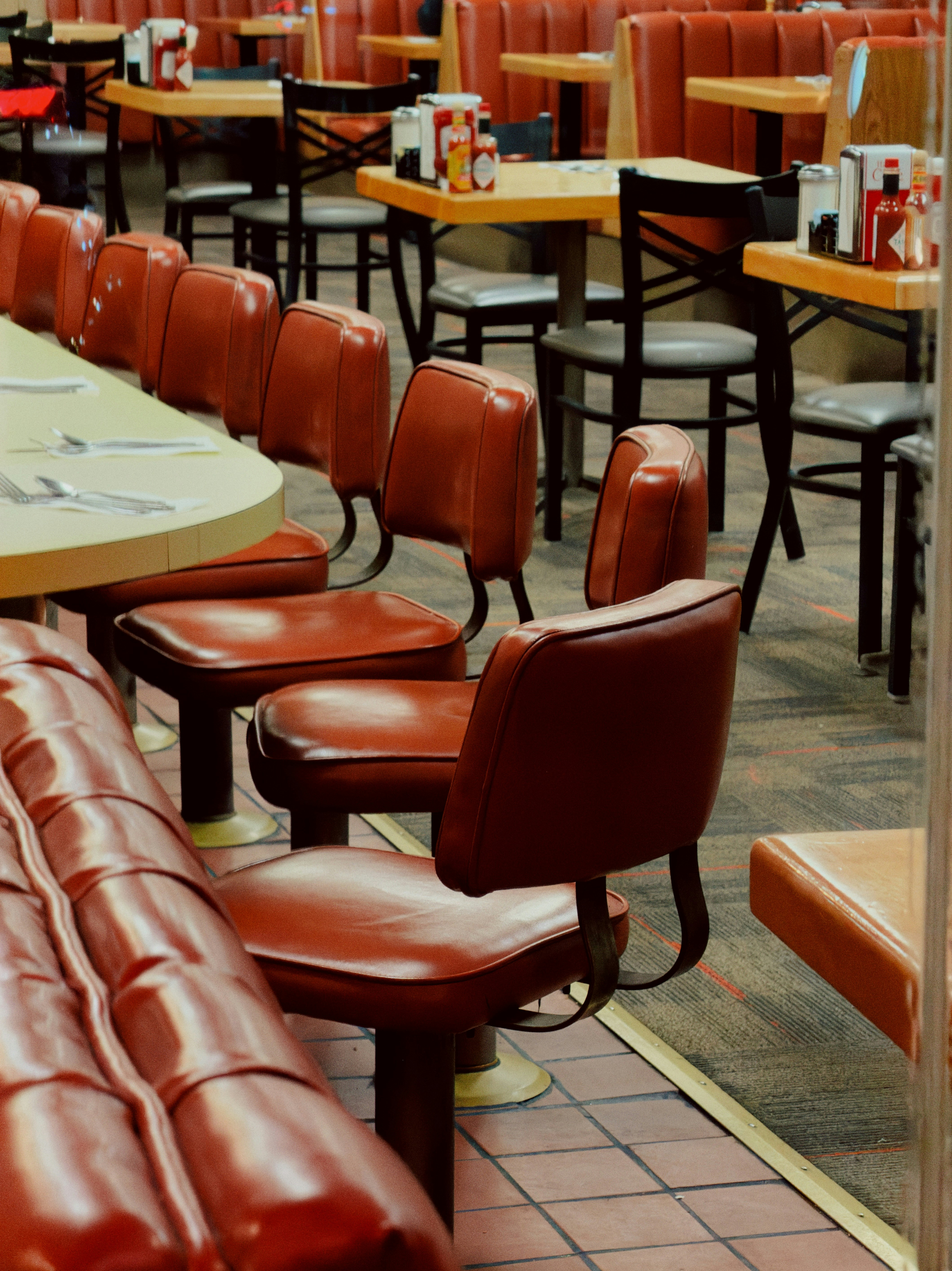 Red Leather Chairs in a Calm Diner Orbit
