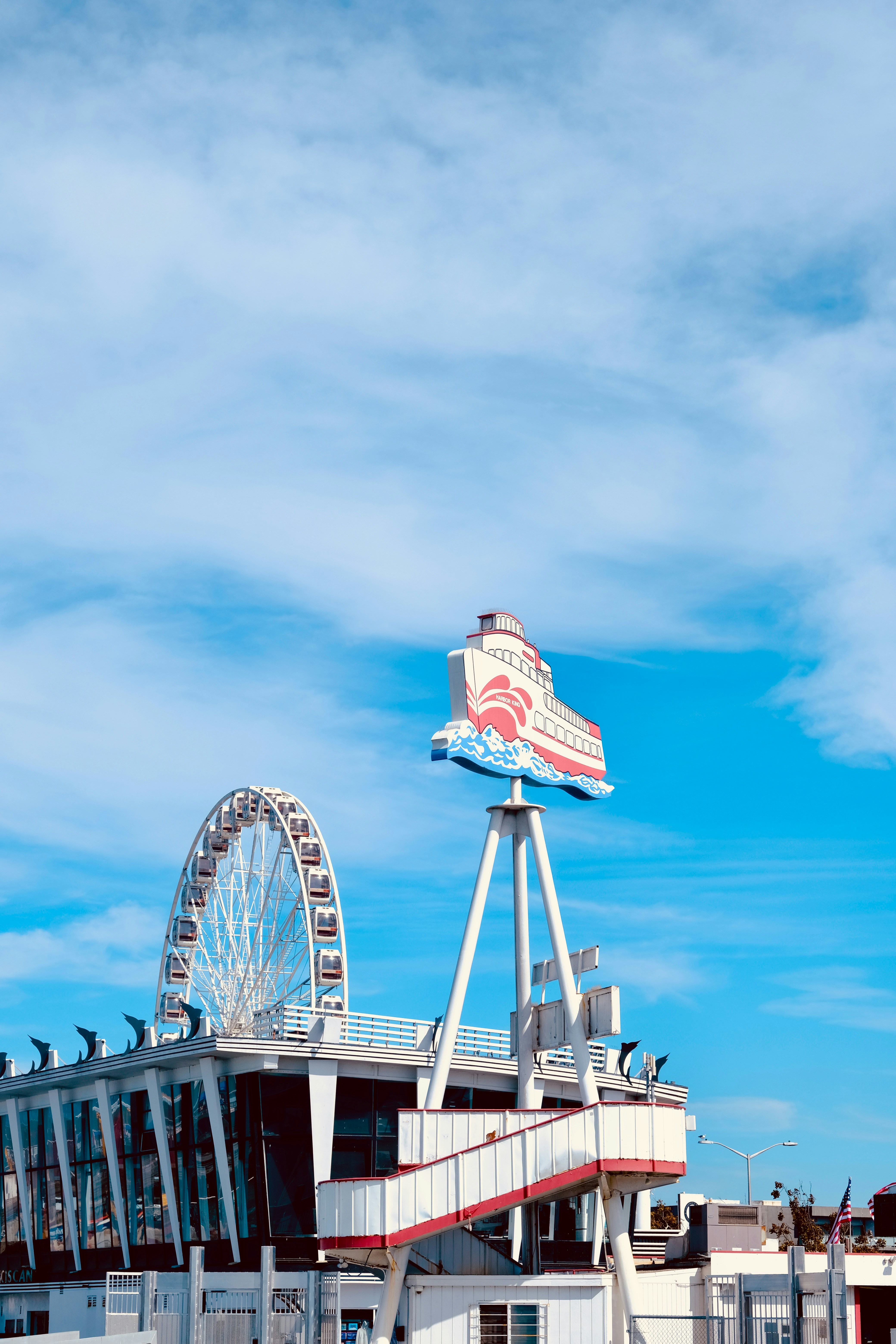 Farewell to the Pier: A Retro Ferry Sign Above the Waterfront