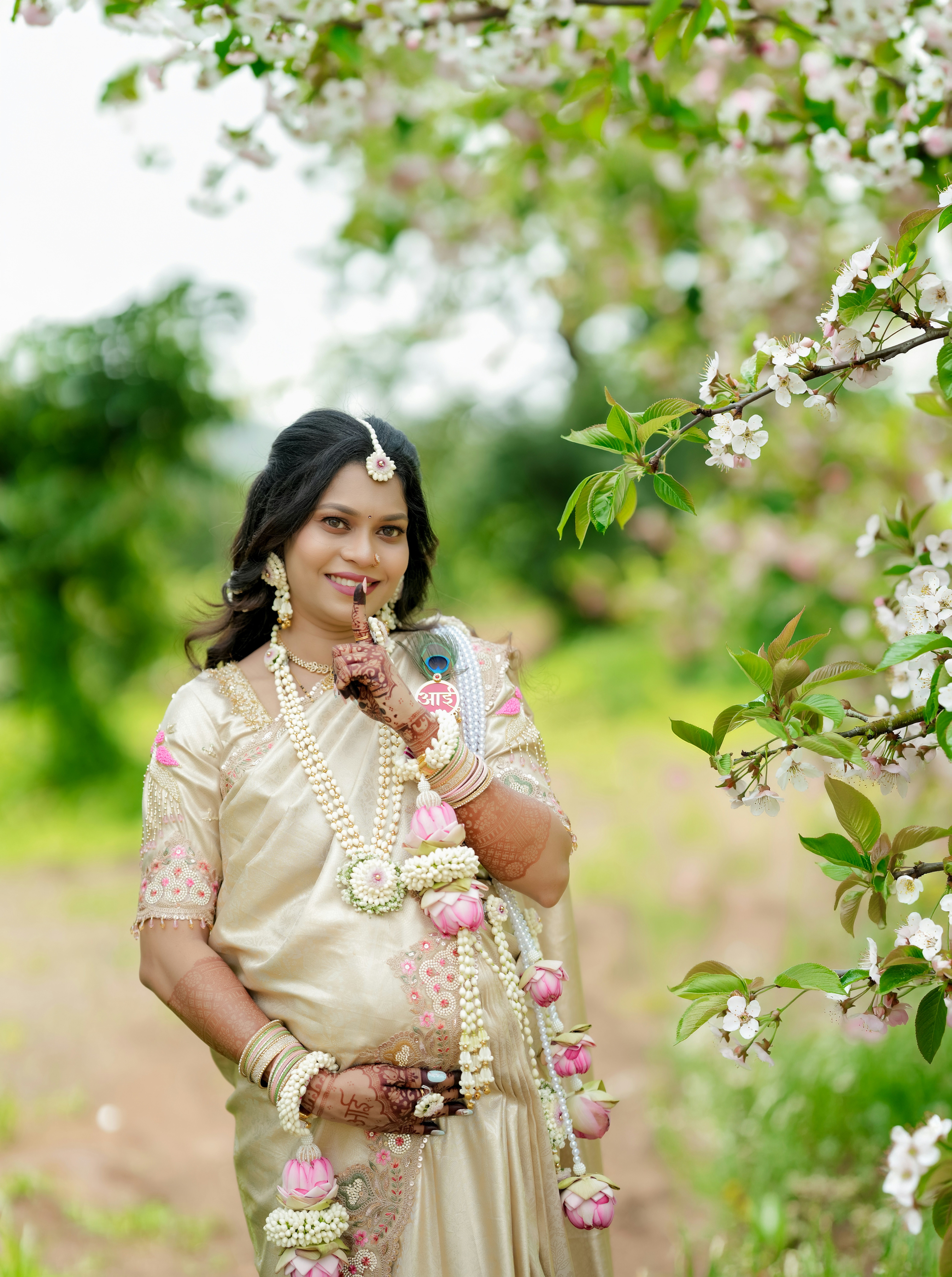 Bride in Bloom: Garlands and Grace under a Blossoming Canopy