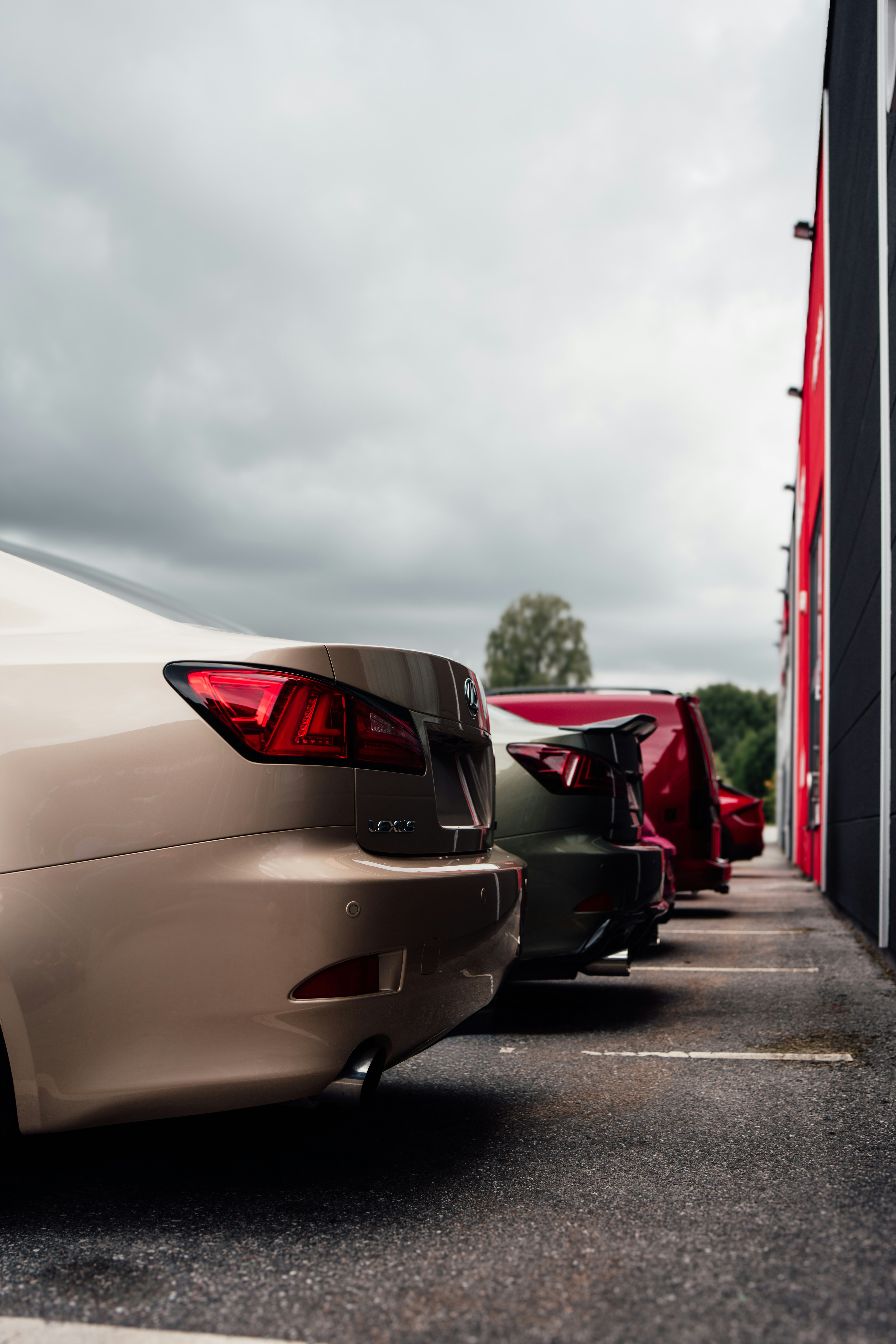 Trailing Lineup: A Row of Sedate Sedans at the Depot