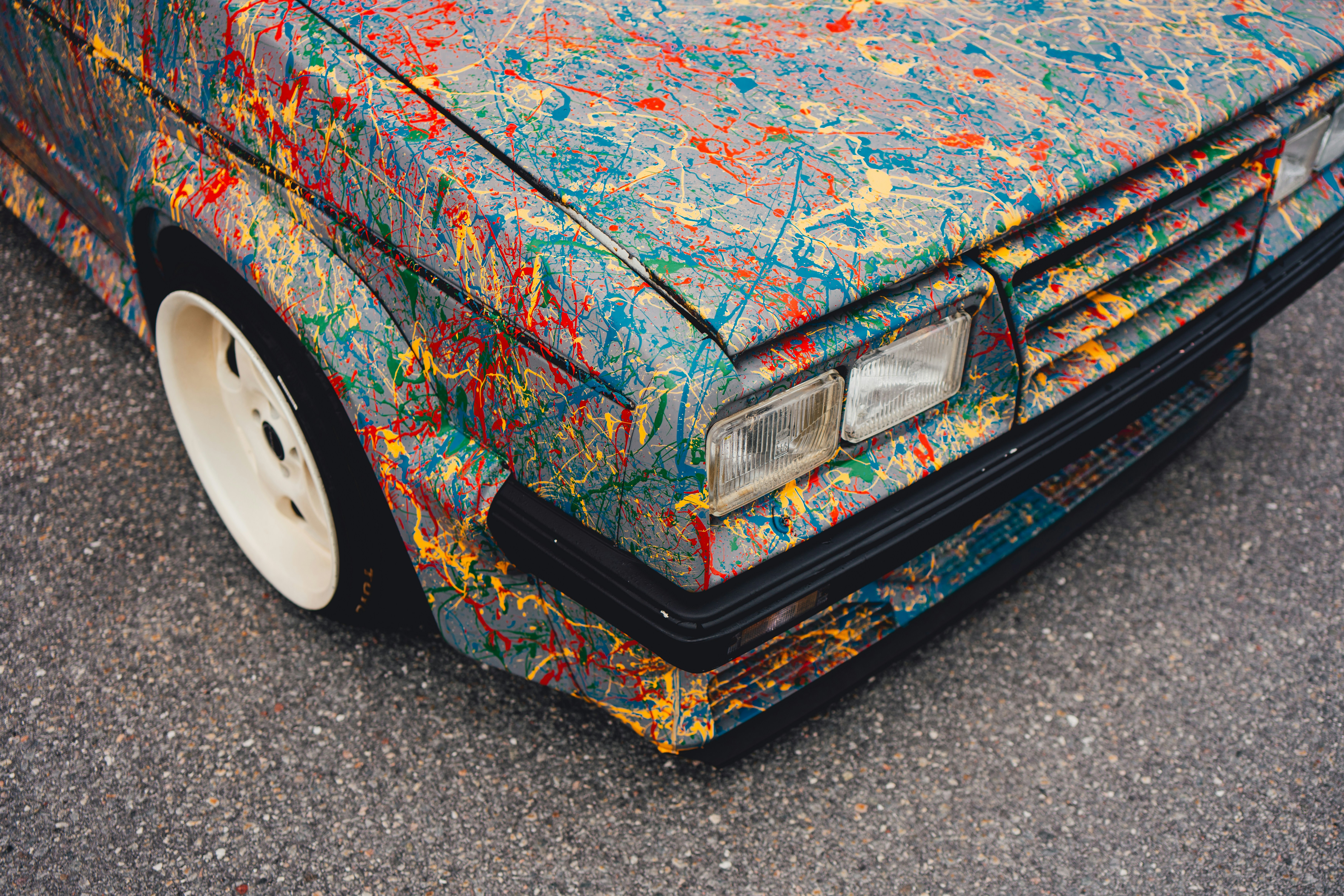 Artistic Paint-Splattered Car Front Corner