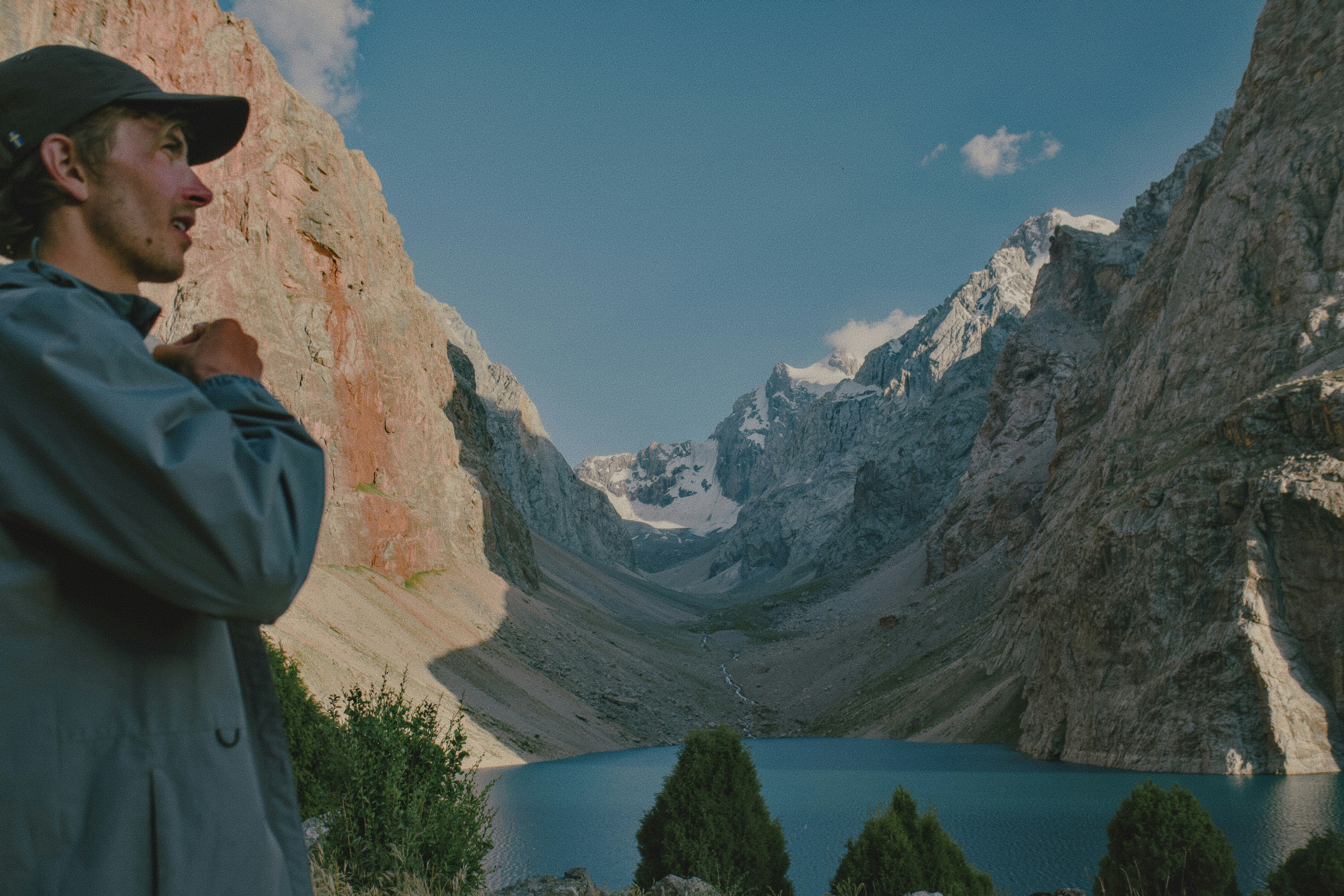Ridge Echoes: A Traveler Gazes Toward Alpine Silence