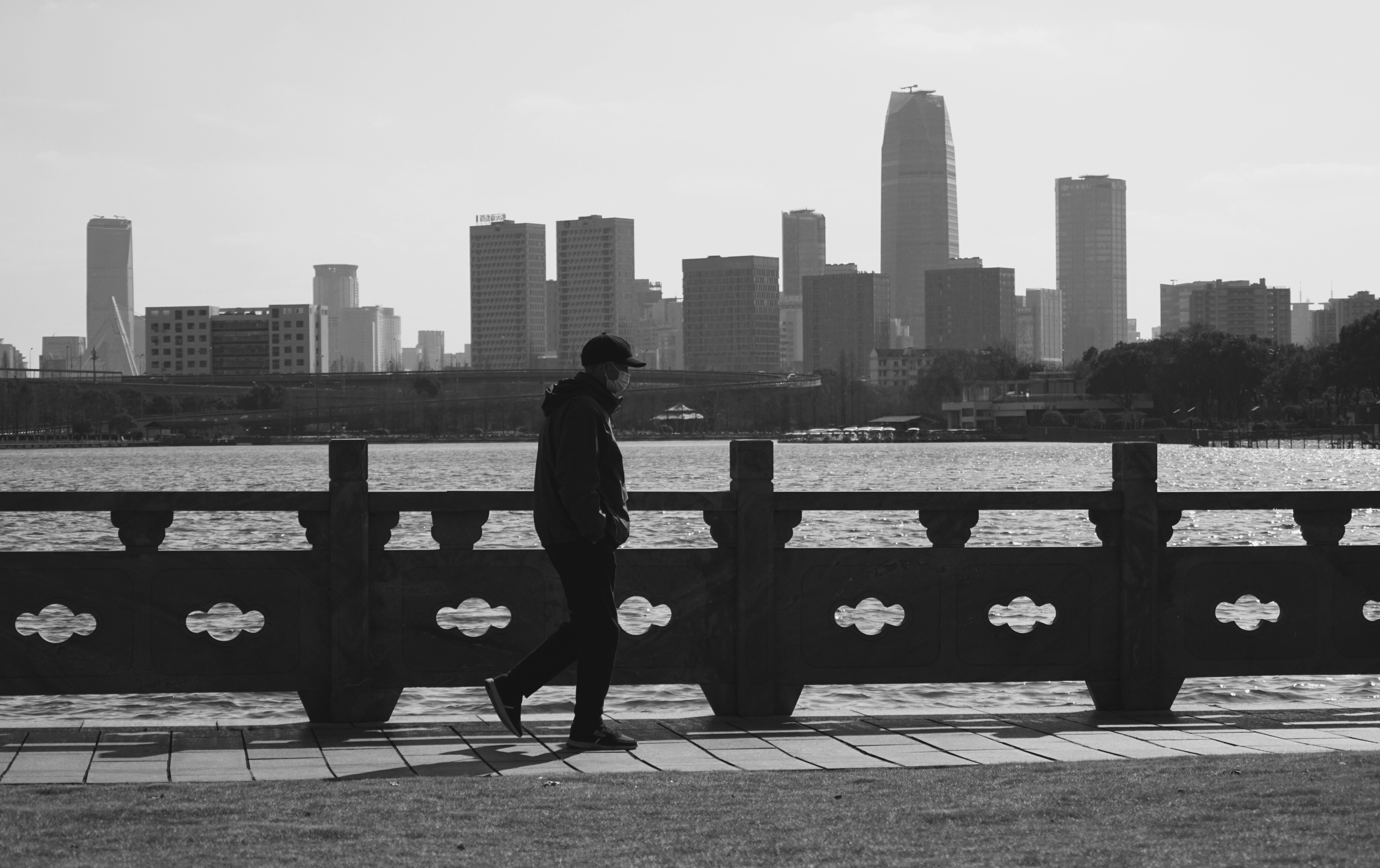 Silhouette on the Waterfront: A Stroll Beneath the Skyline