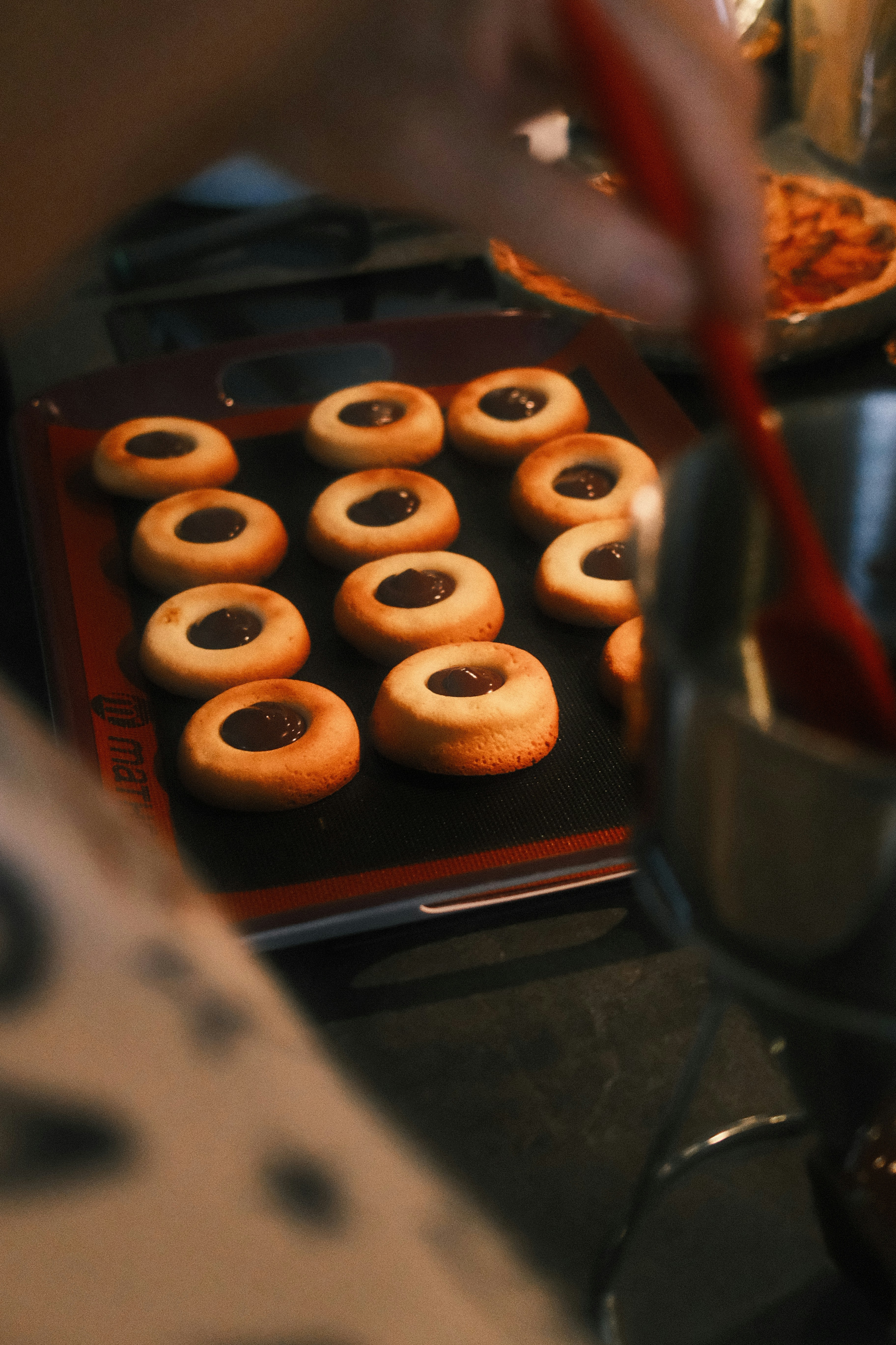 Hot Tray of Central Ring Doughnuts in a Busy Kitchen