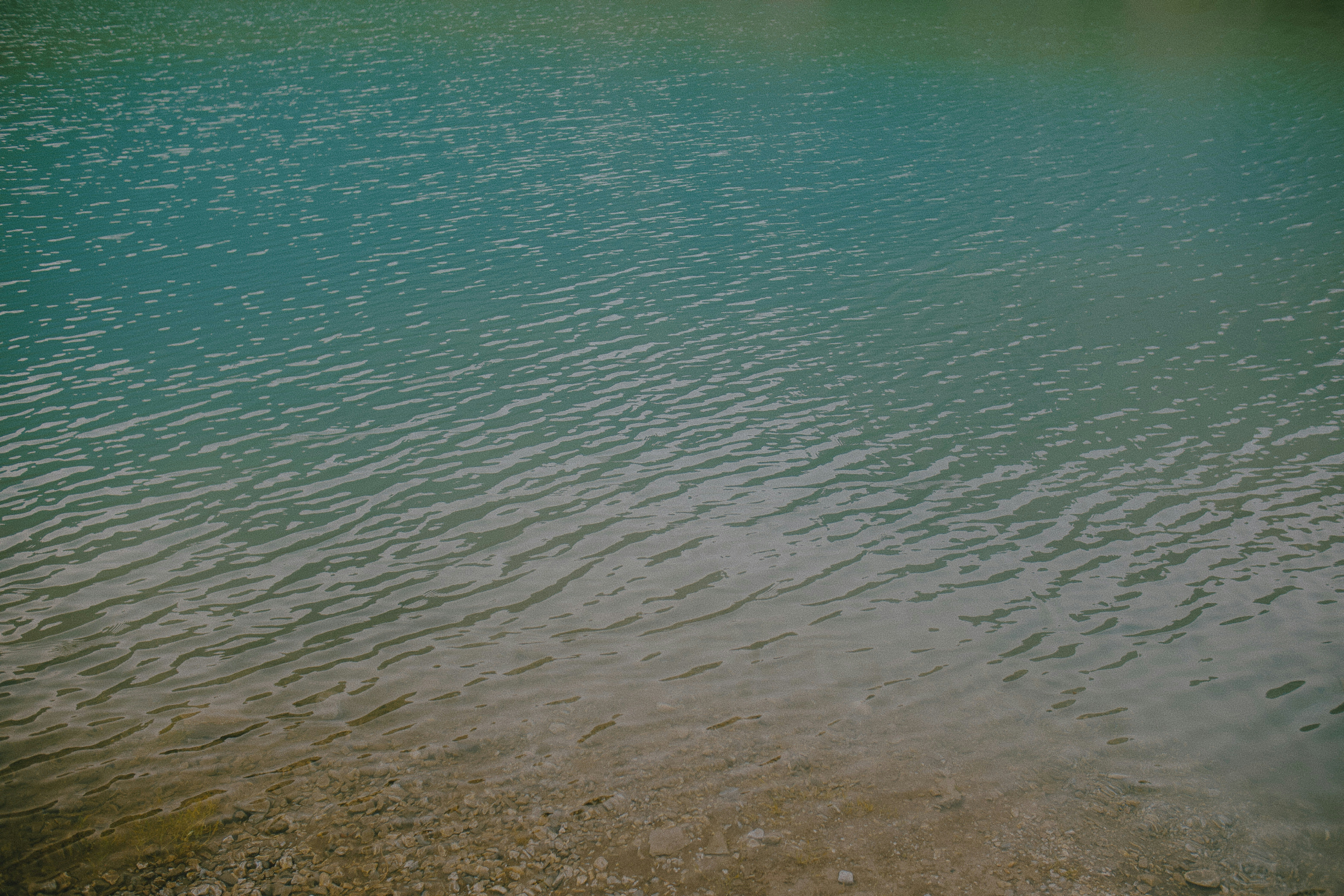 Quiet Shoreline: Aquatic Gradient from Pebble to Blue-green Water