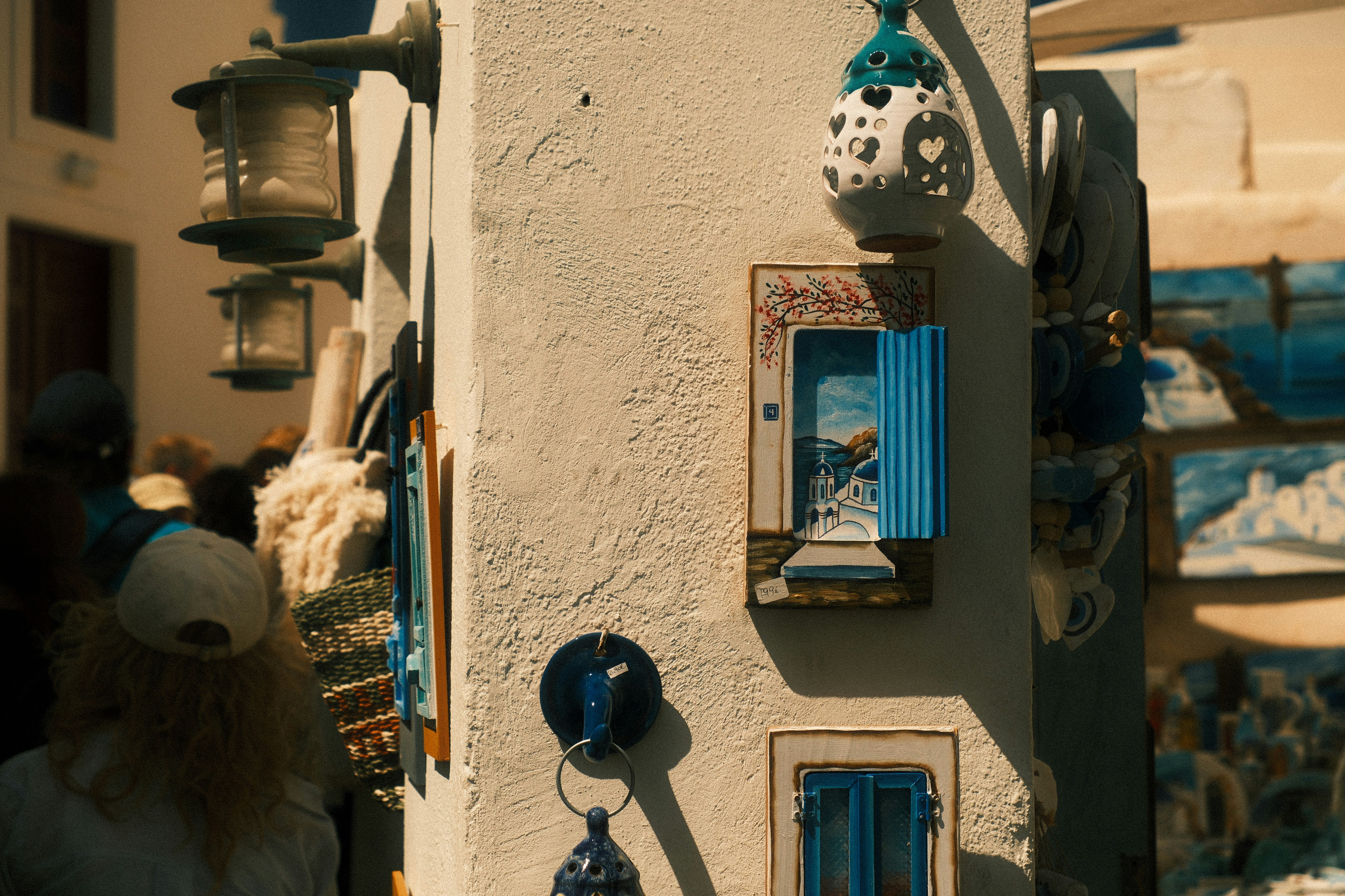 Blue-Accented Lanterns on a Sunlit Mediterranean Street Corner