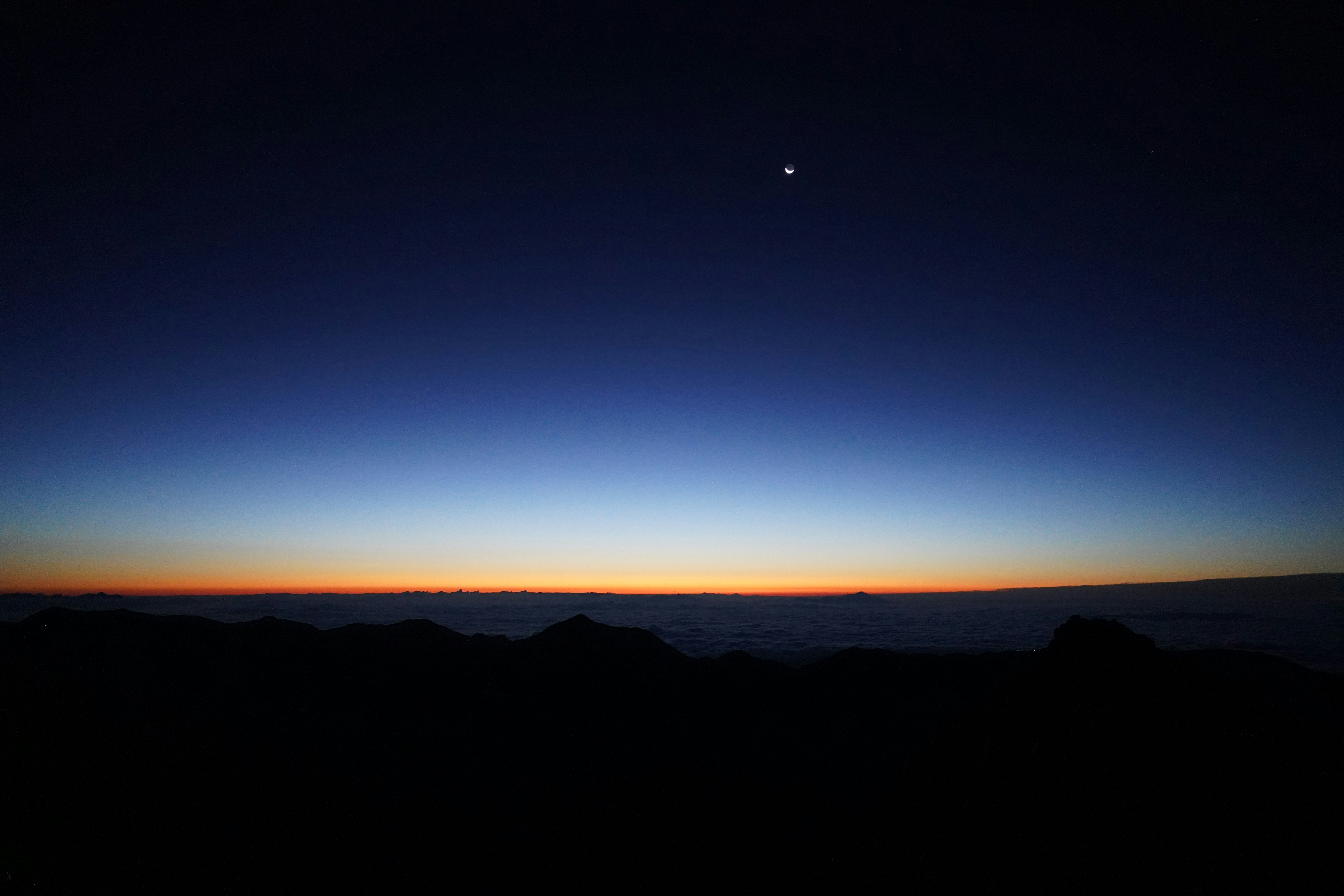 Dawn’s Quiet Horizon: A Velvet Sky Above the Silhouette