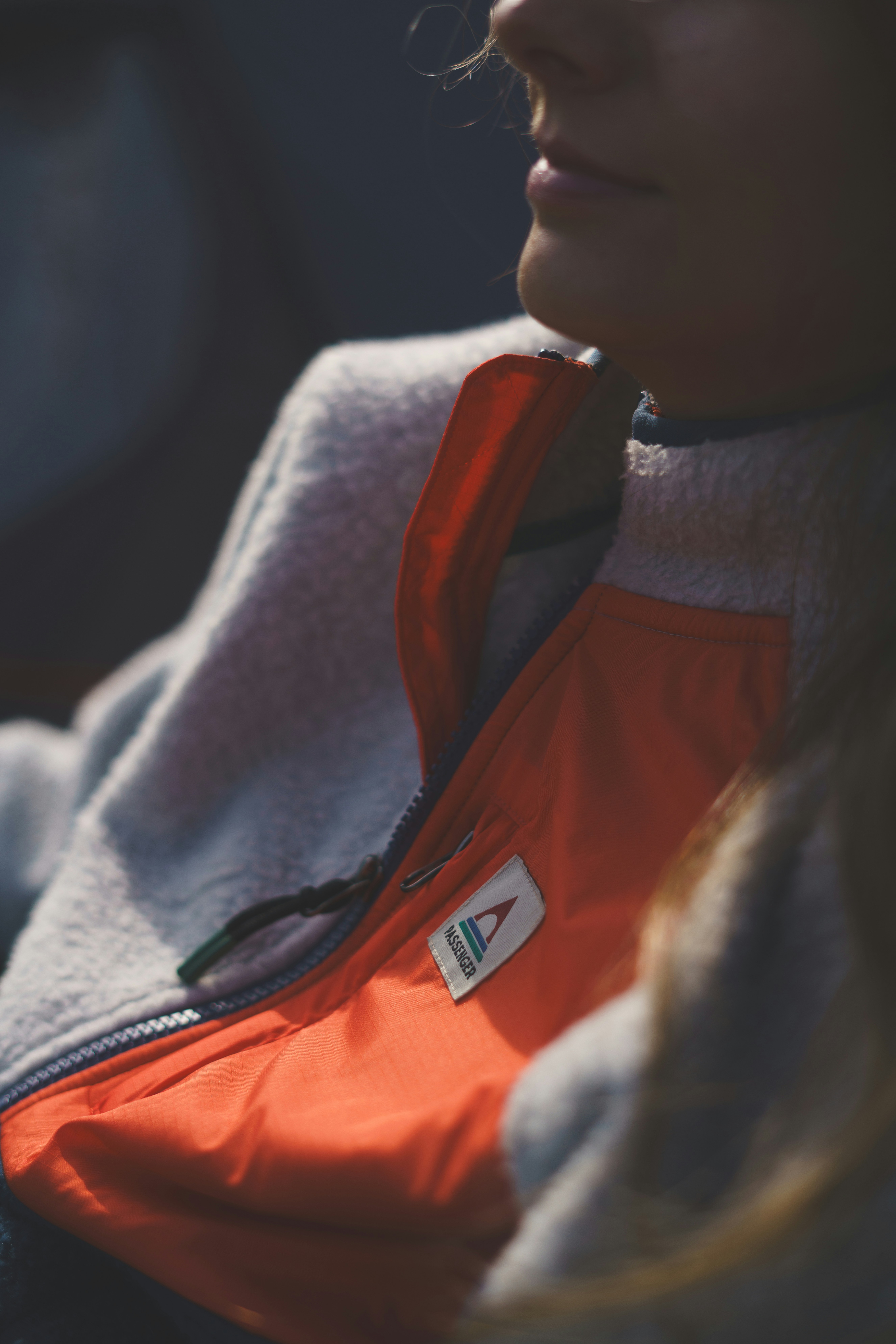 Chasing Warm Light: A Close-Up of a Bright Orange Zip Pocket