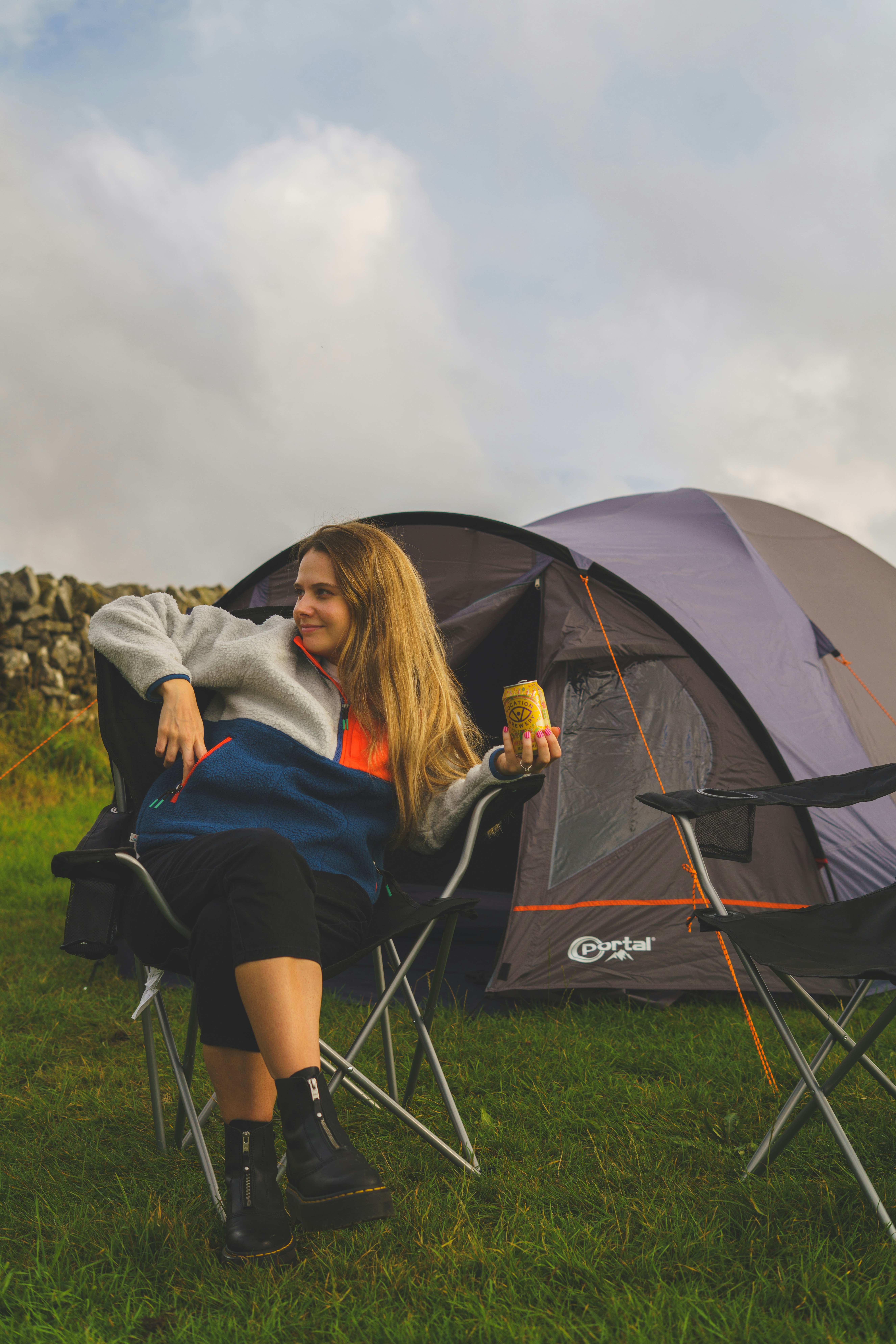 Relaxed Camper in Front of a Violet-Toned Tent