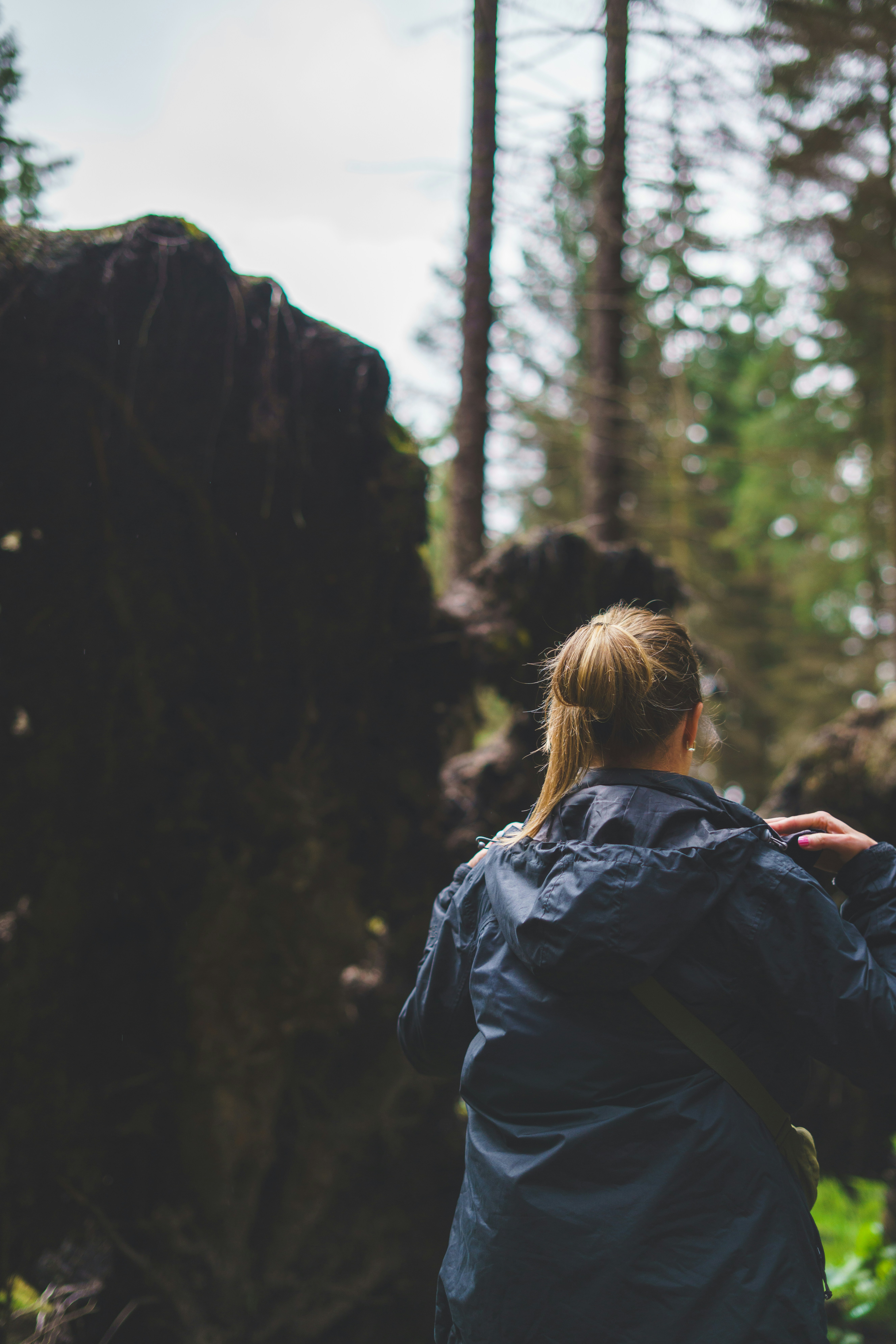 Traveler in a Mossy Canyon: Portrait behind a backpack