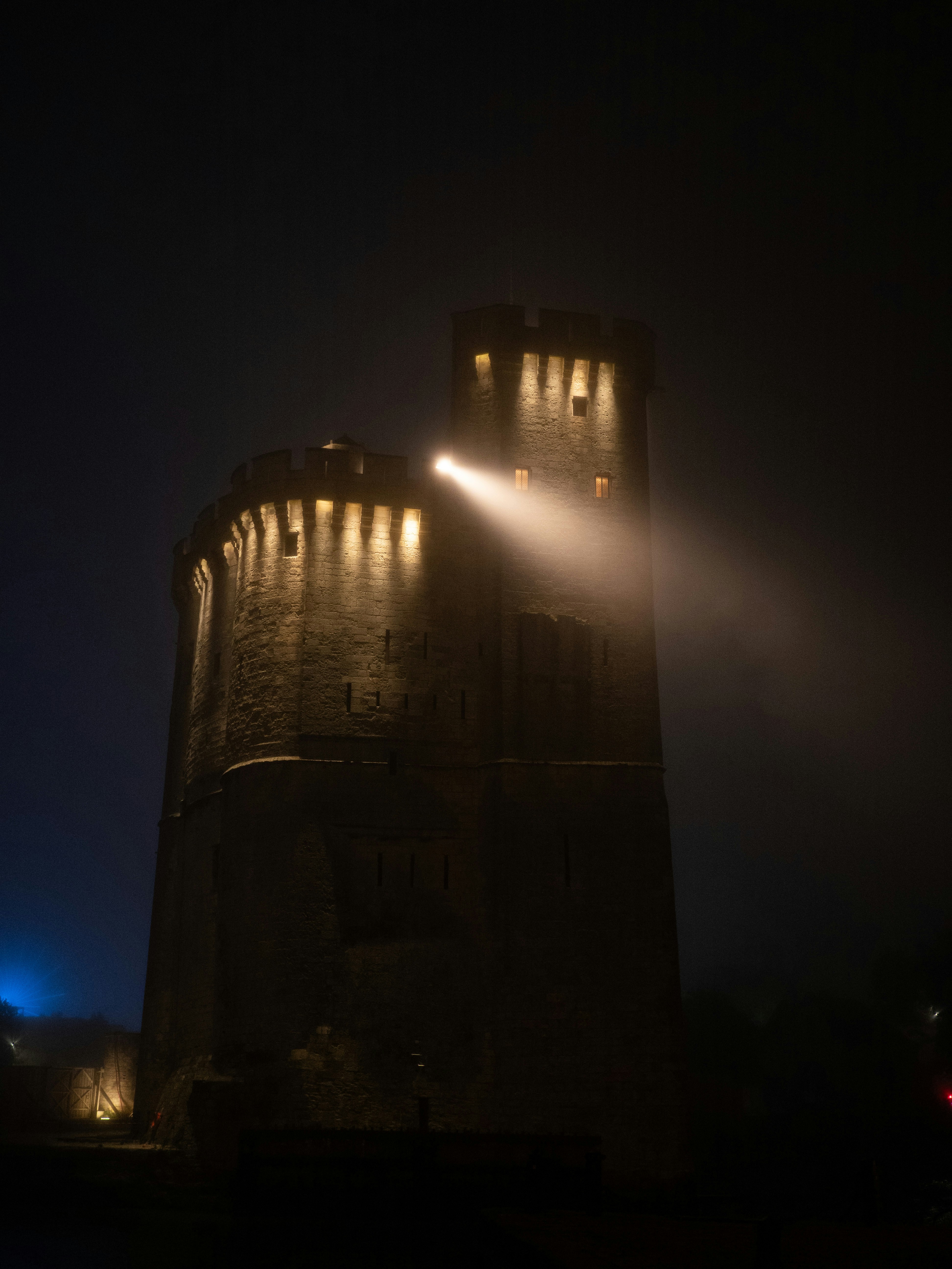 Beacon in the Fog: A Tower Illuminated by a Single Brilliant Beam