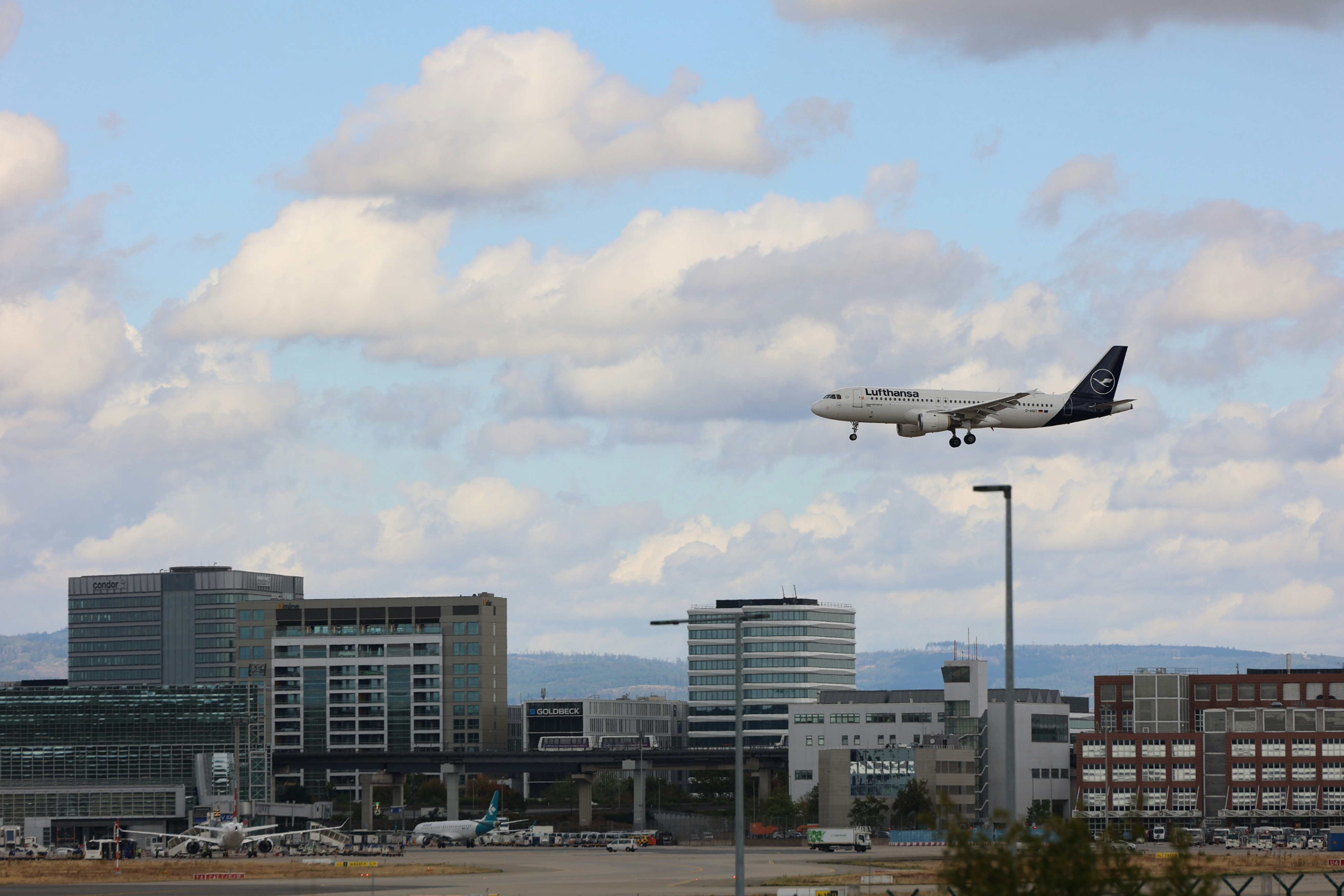 Landing in the Skyline: A Jet Descends Over the Cityscape