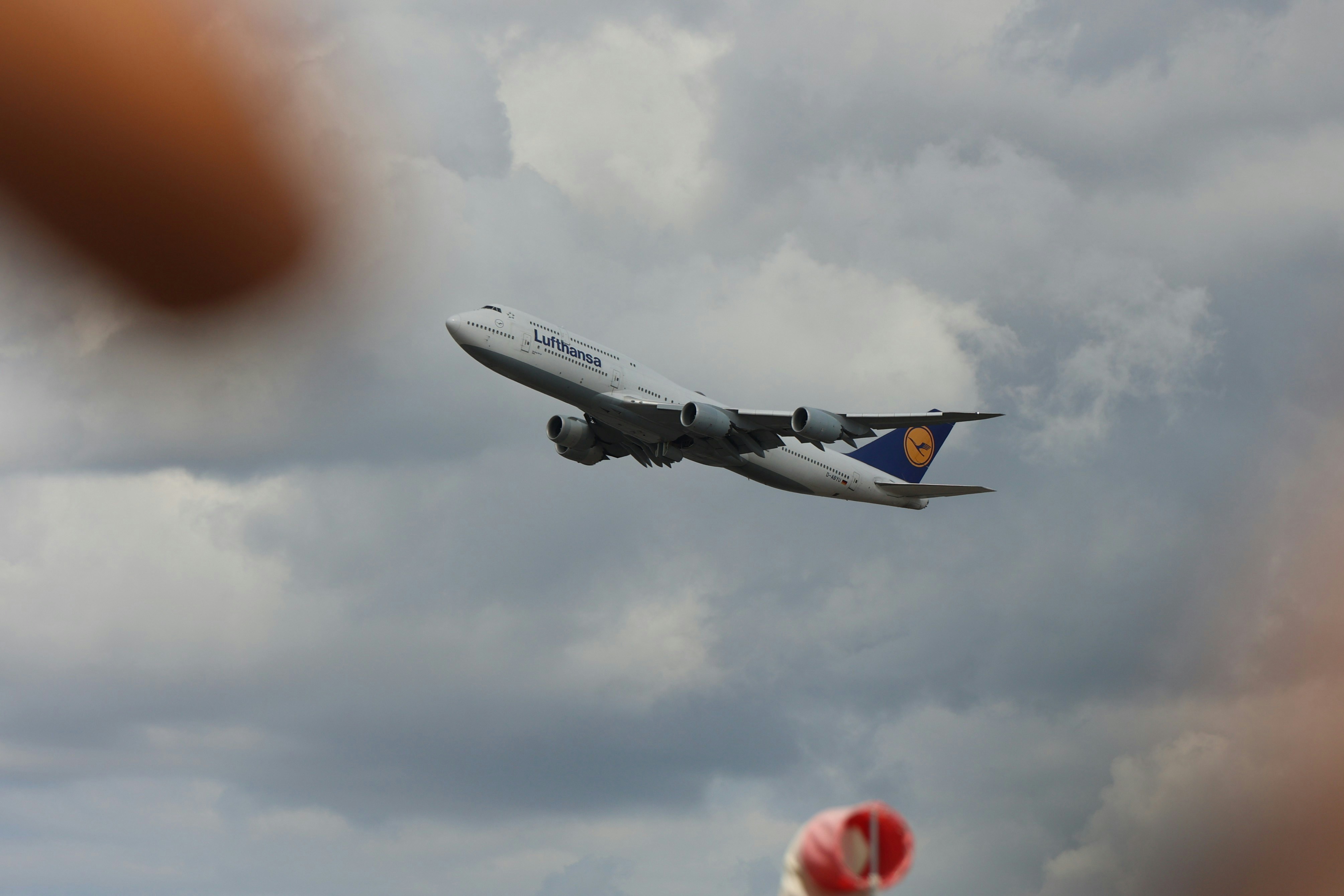 Jet Arcing Through Cloudscape: Lufthansa in the Skies