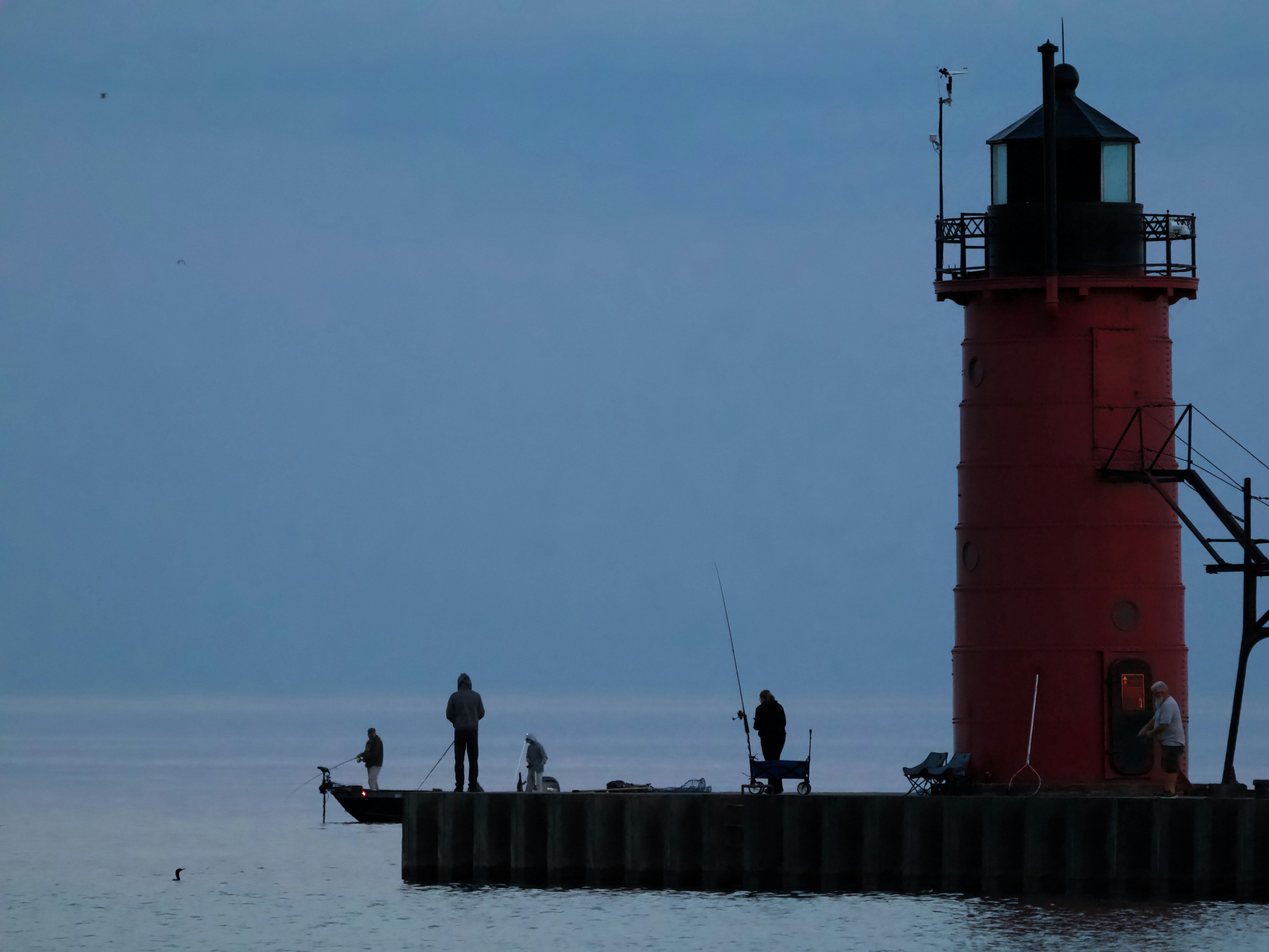Harbor Quiet: The Red Watchtower Keeps Watch Over Evening Tide