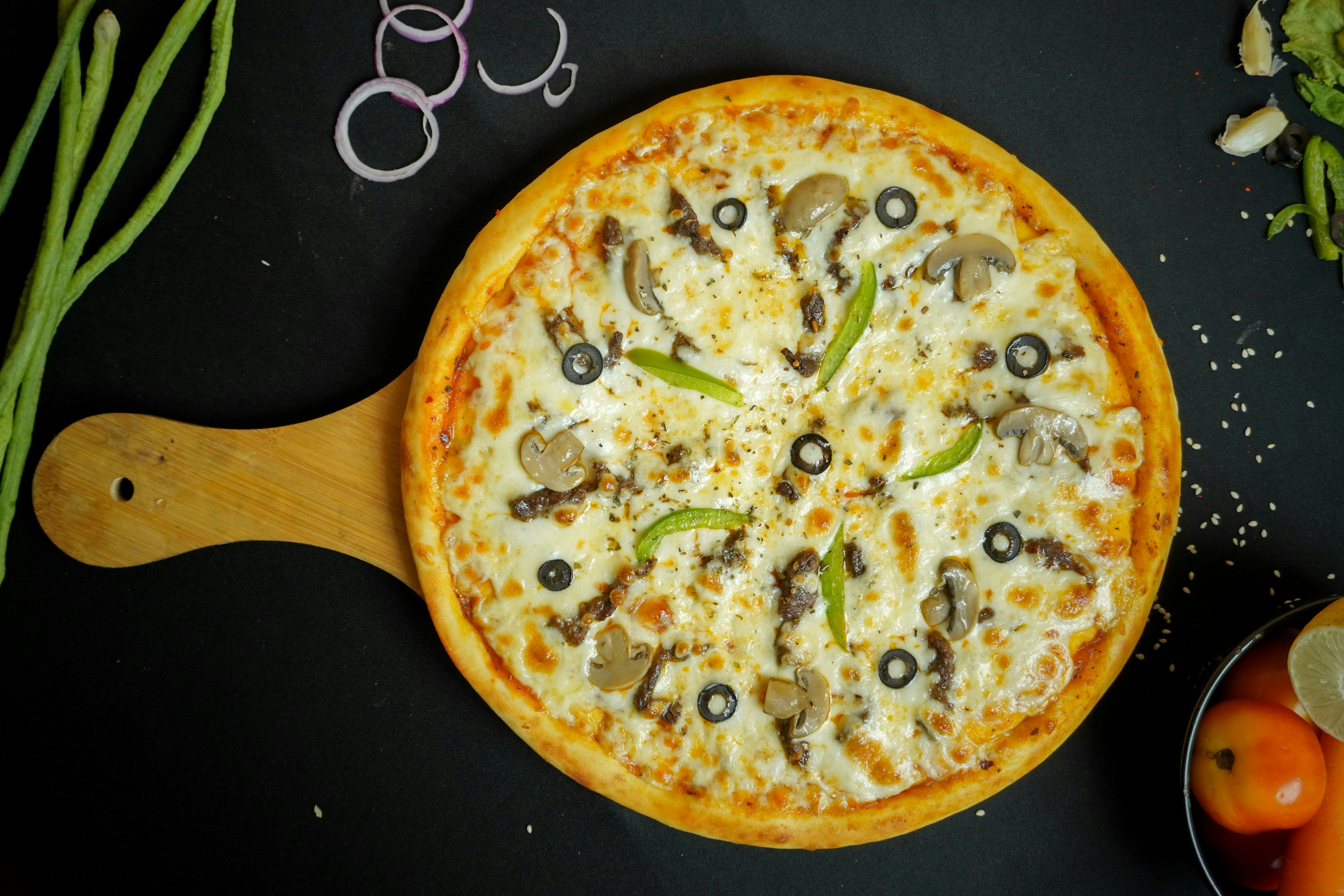 Golden-Edge Pizza on a Blackboard Stage