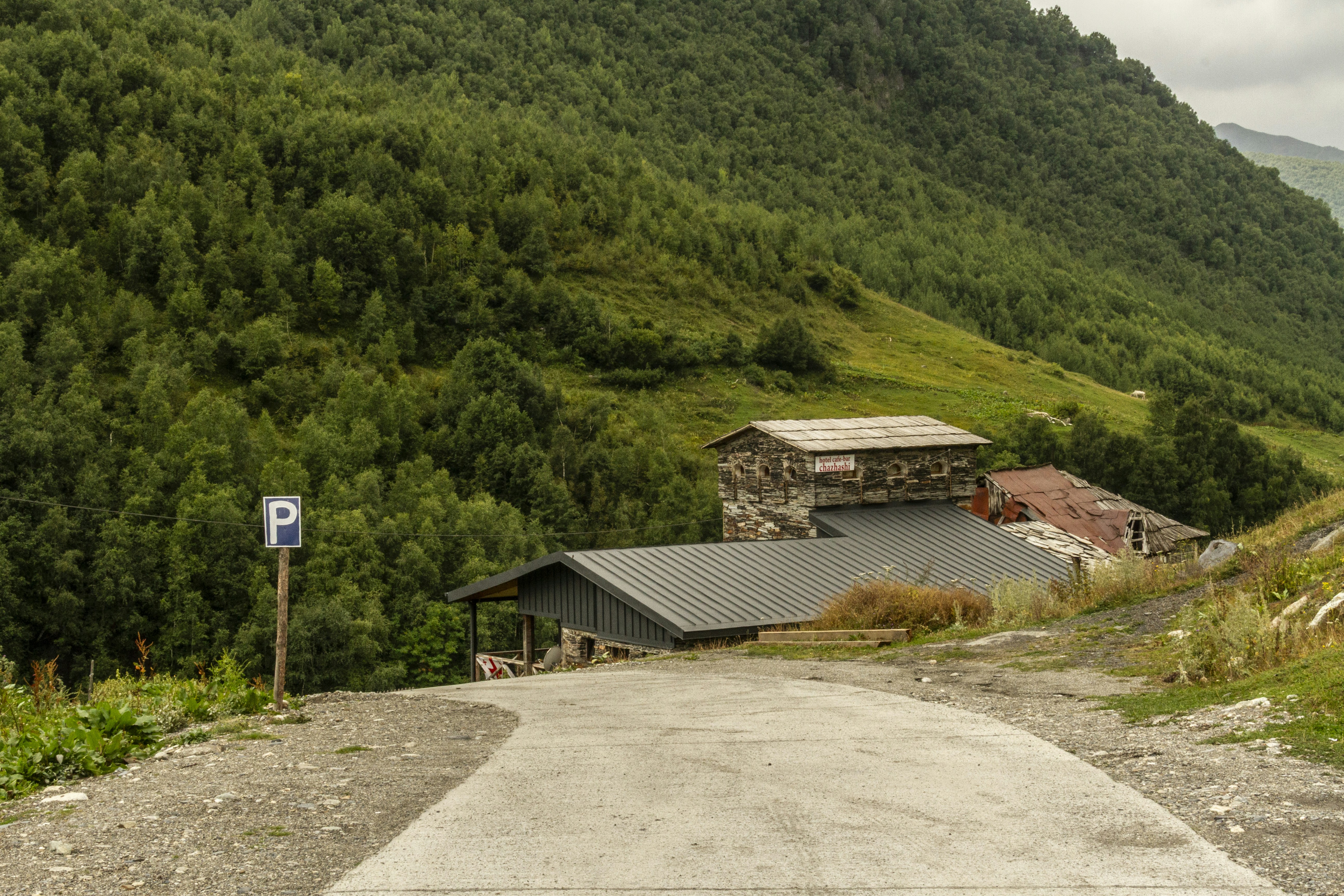 Mountain Trail and rustic shed hemmed by hillside