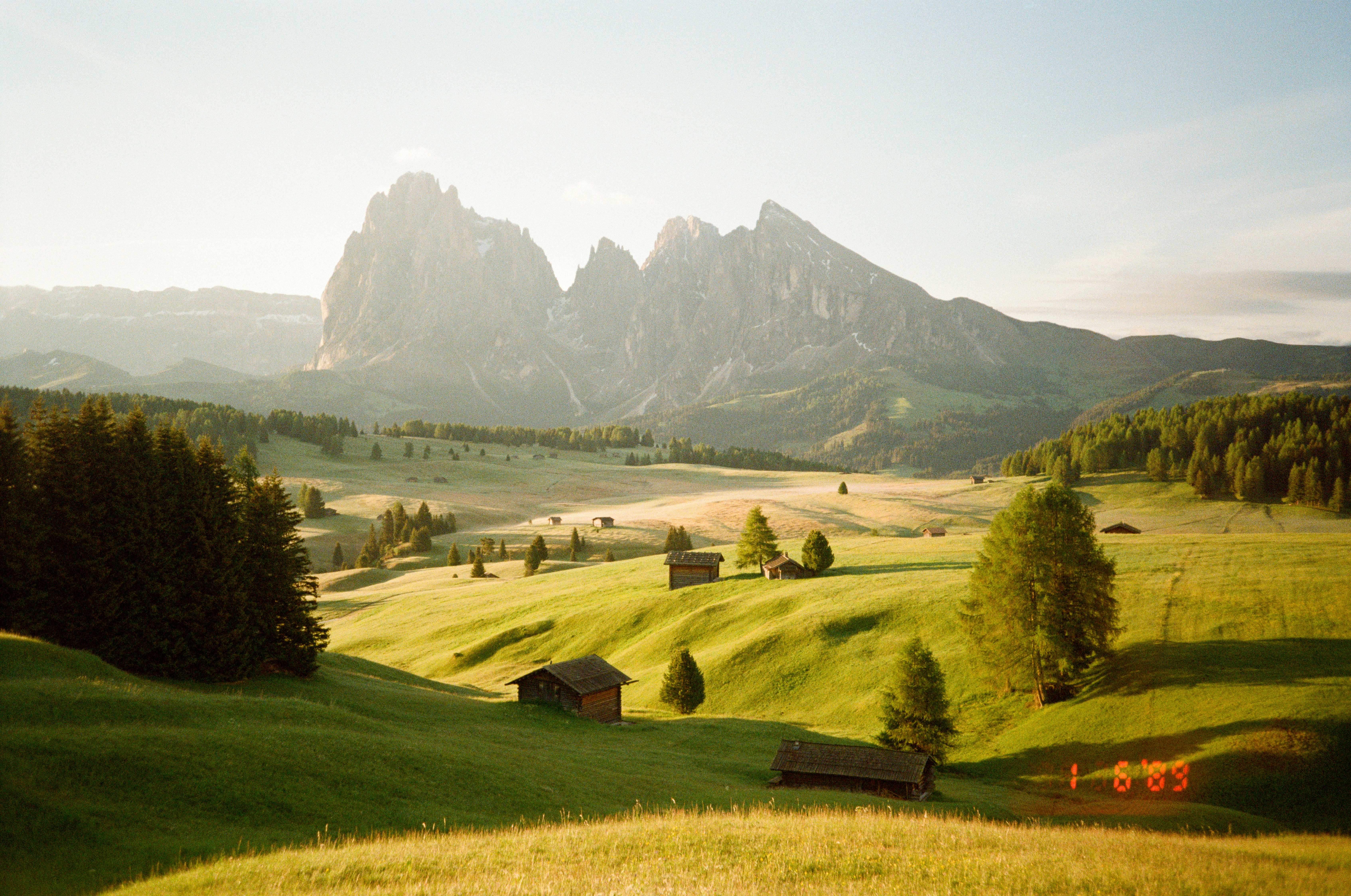 Dolomite sunrise over the alps meadows on film