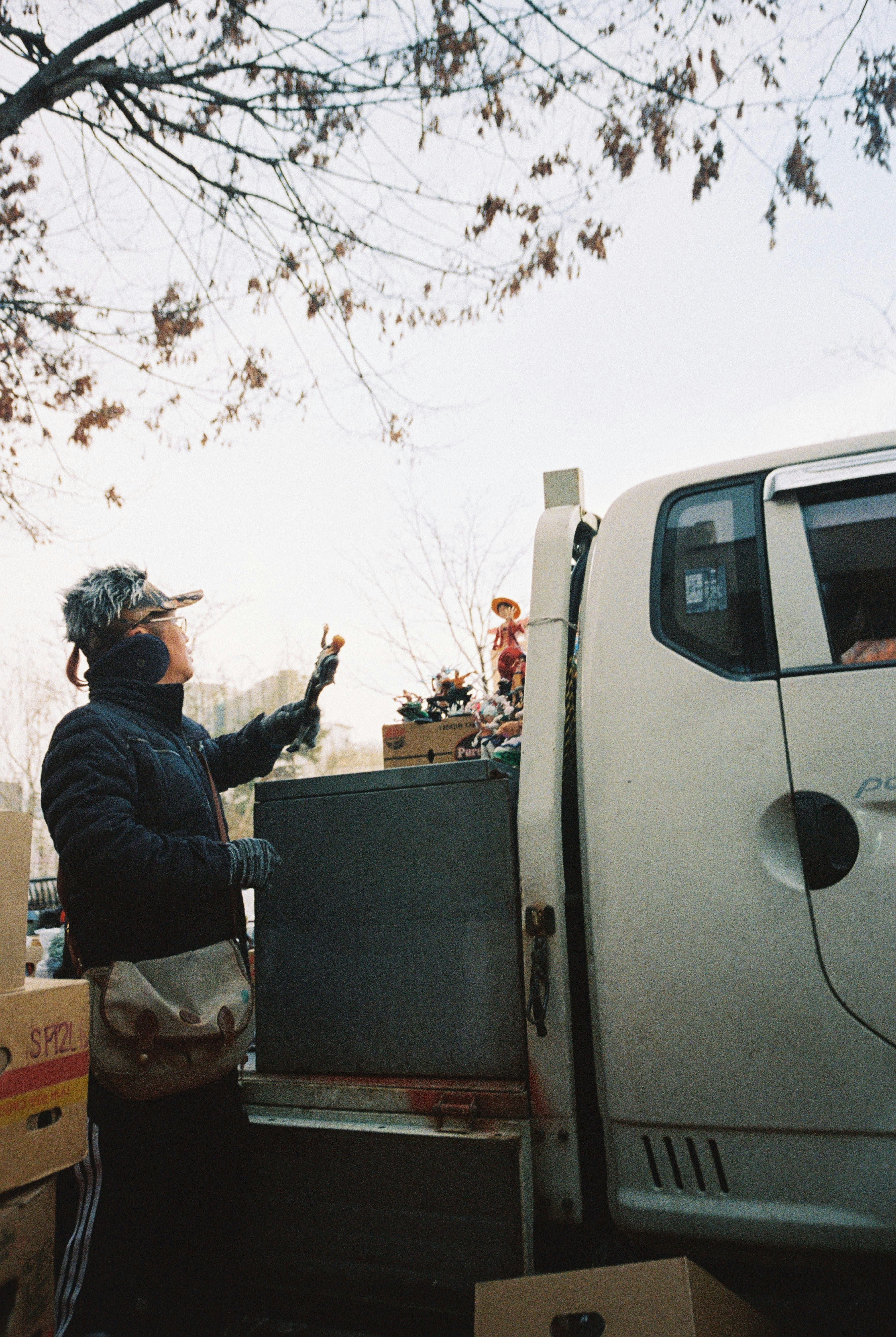The Vendor’s Exchange: A Quiet Moment by the Truck Bed