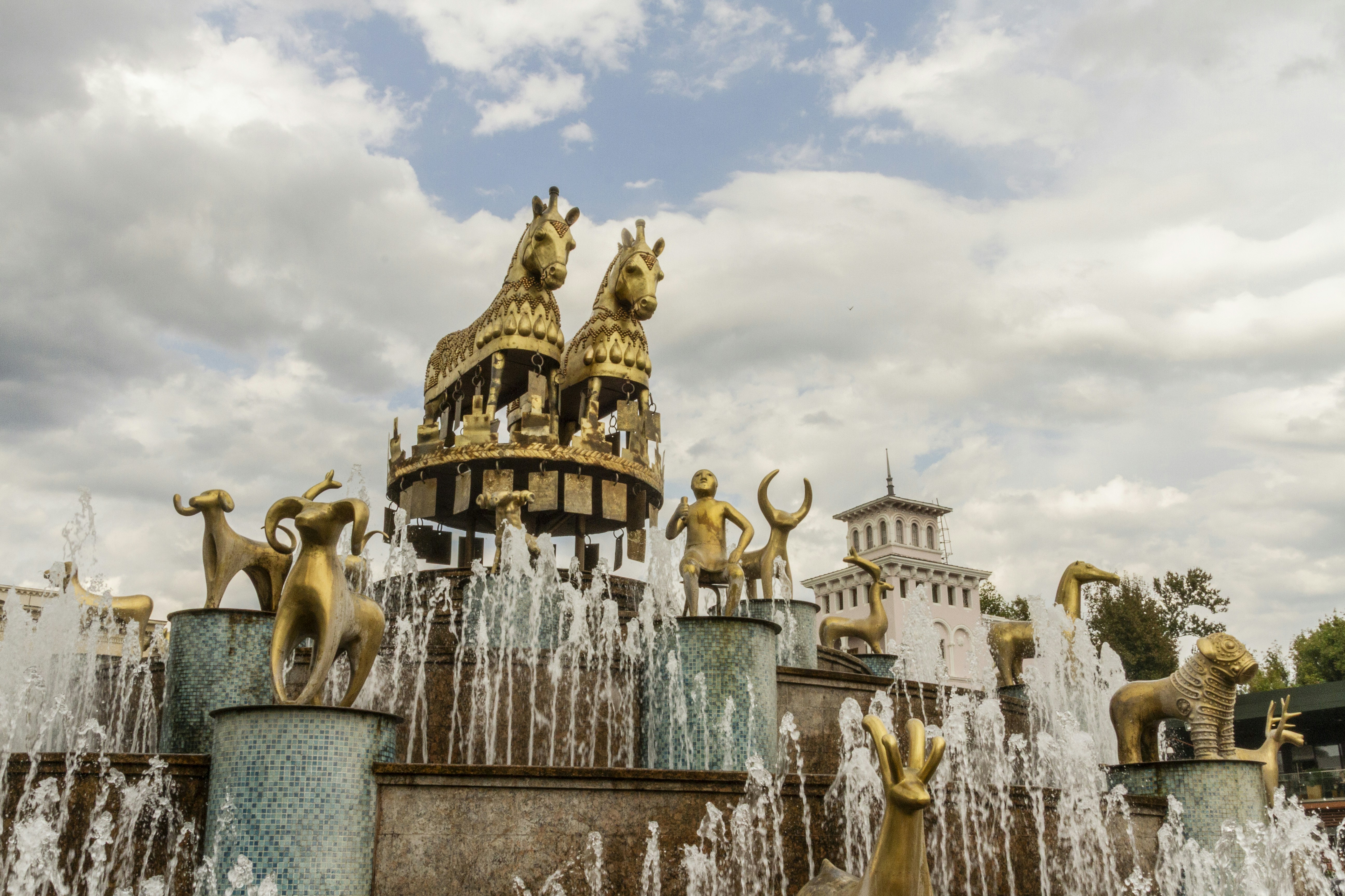 Gilded Deities Above the Cascade