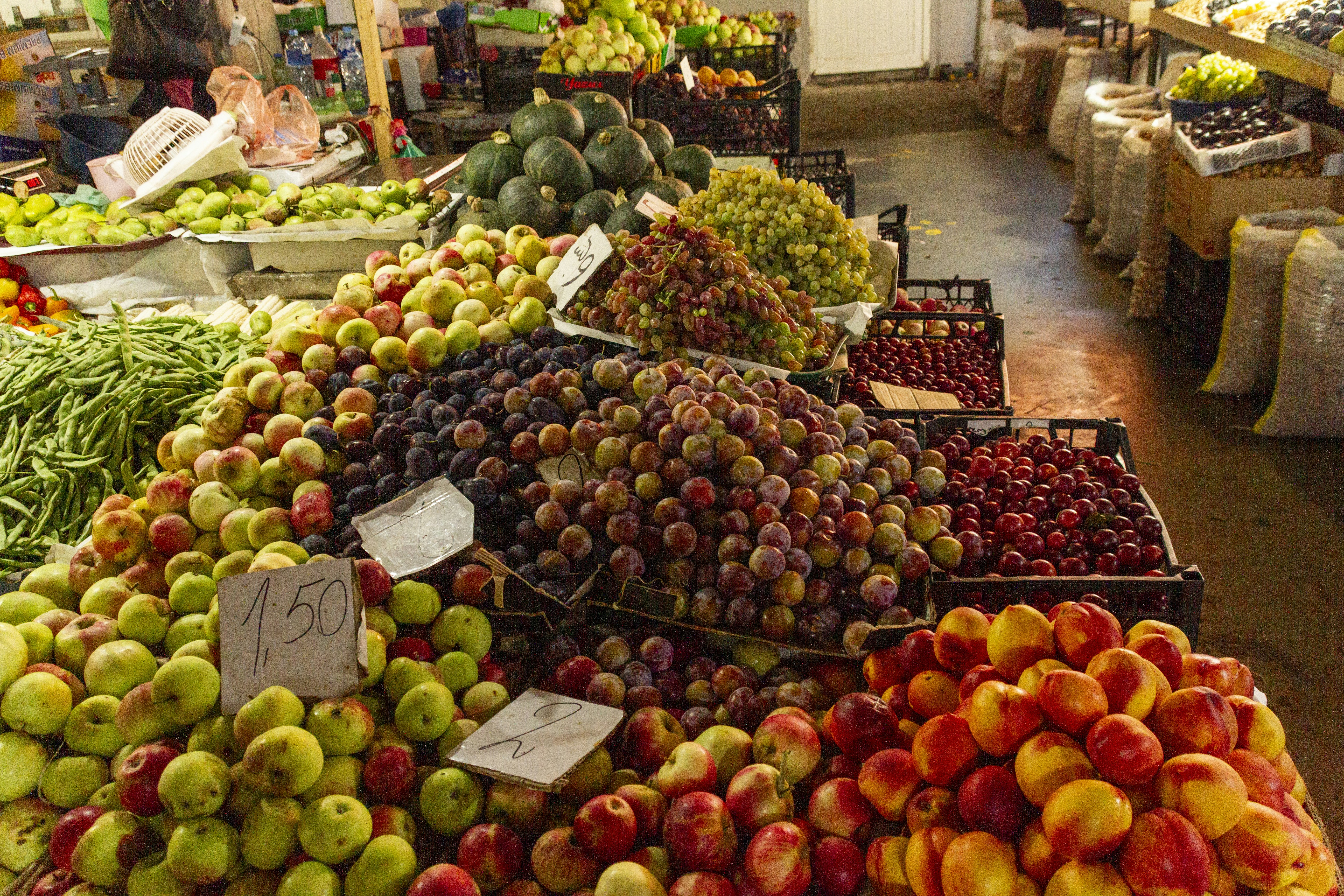 Colorful Fruit Market Spread in a Busy Grocery Aisle