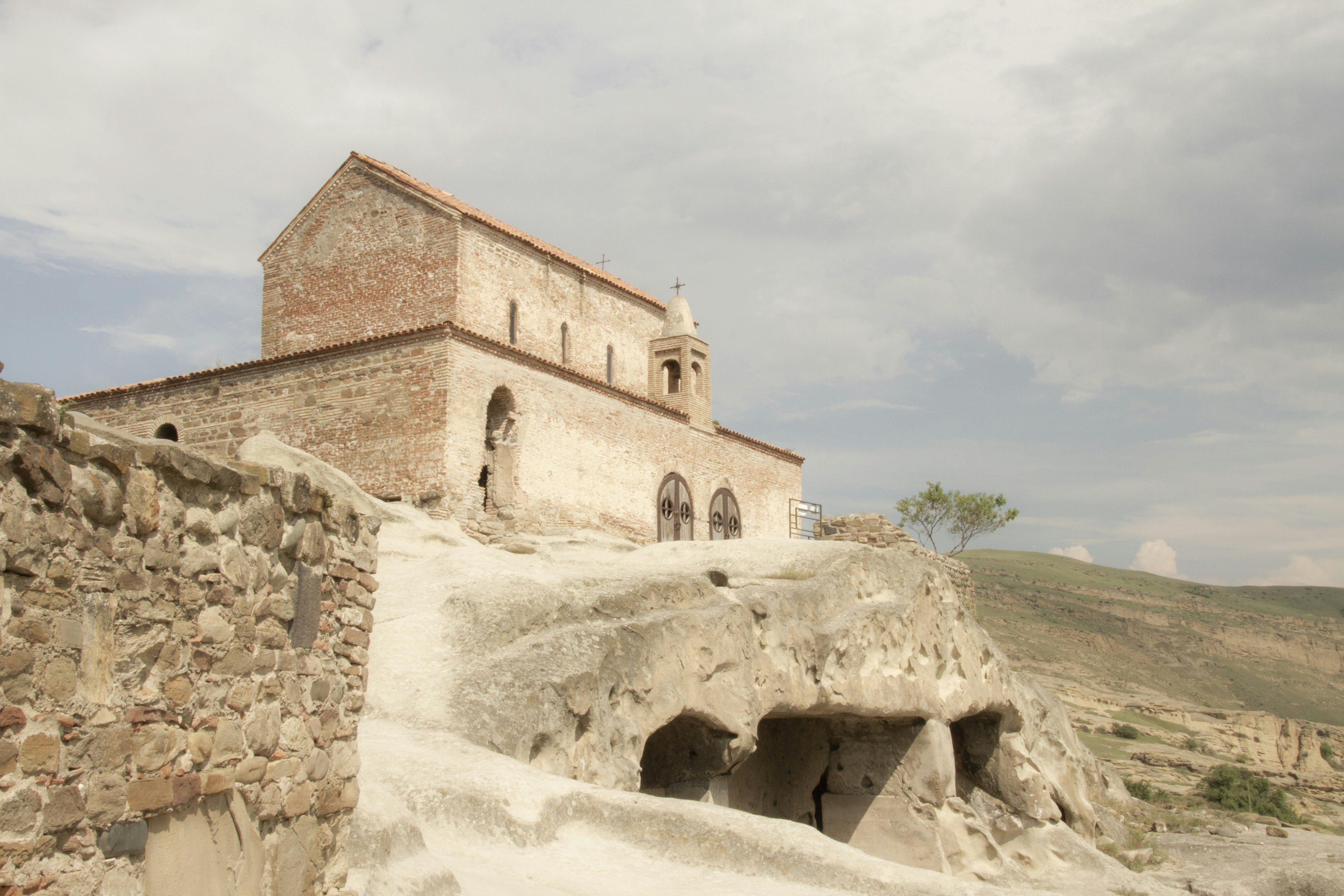 Ancient Rock-cut Chapel Nestled Above the Ridge