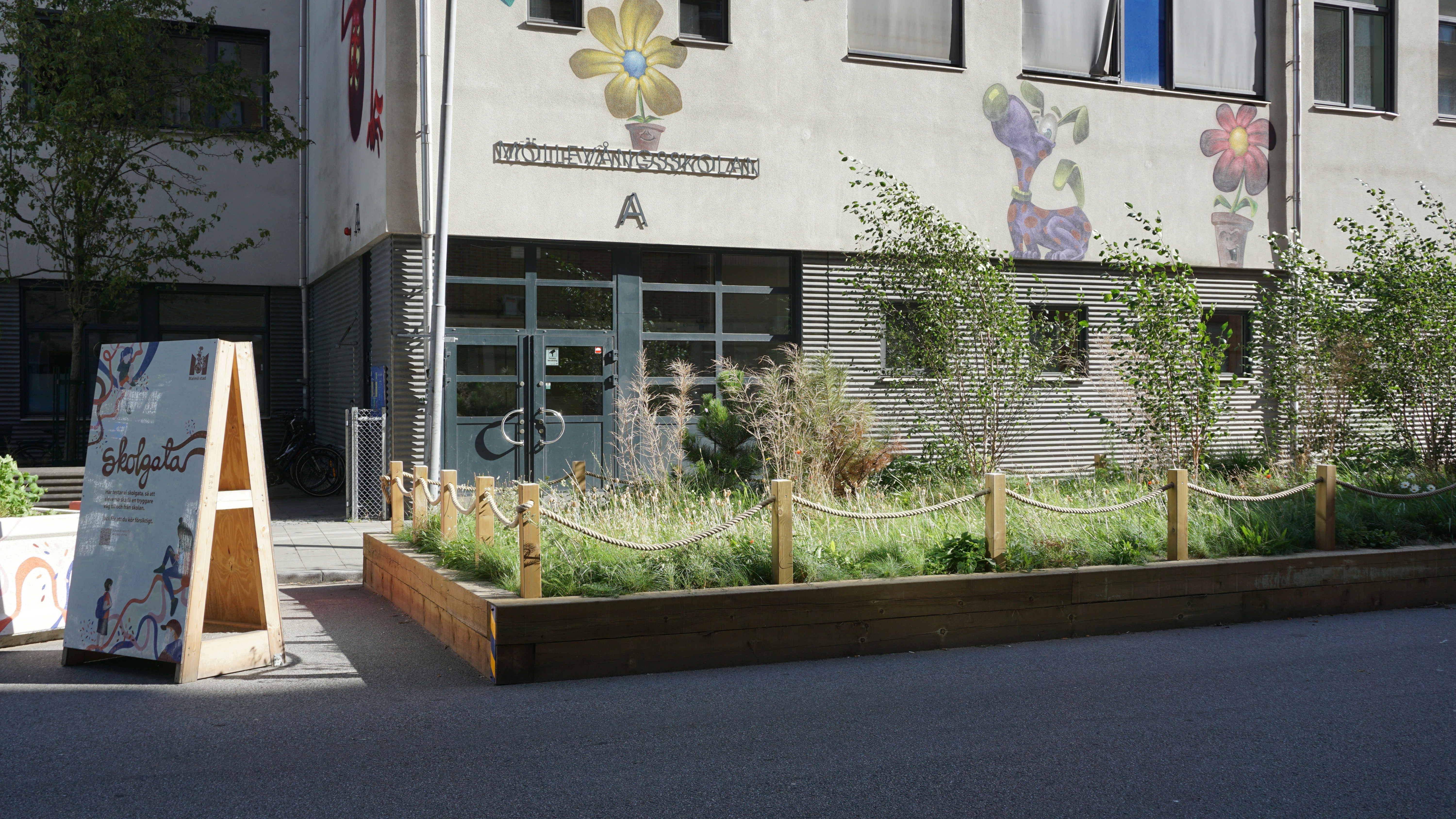 Urban Garden Terrace by a Facade with Painted Flowers