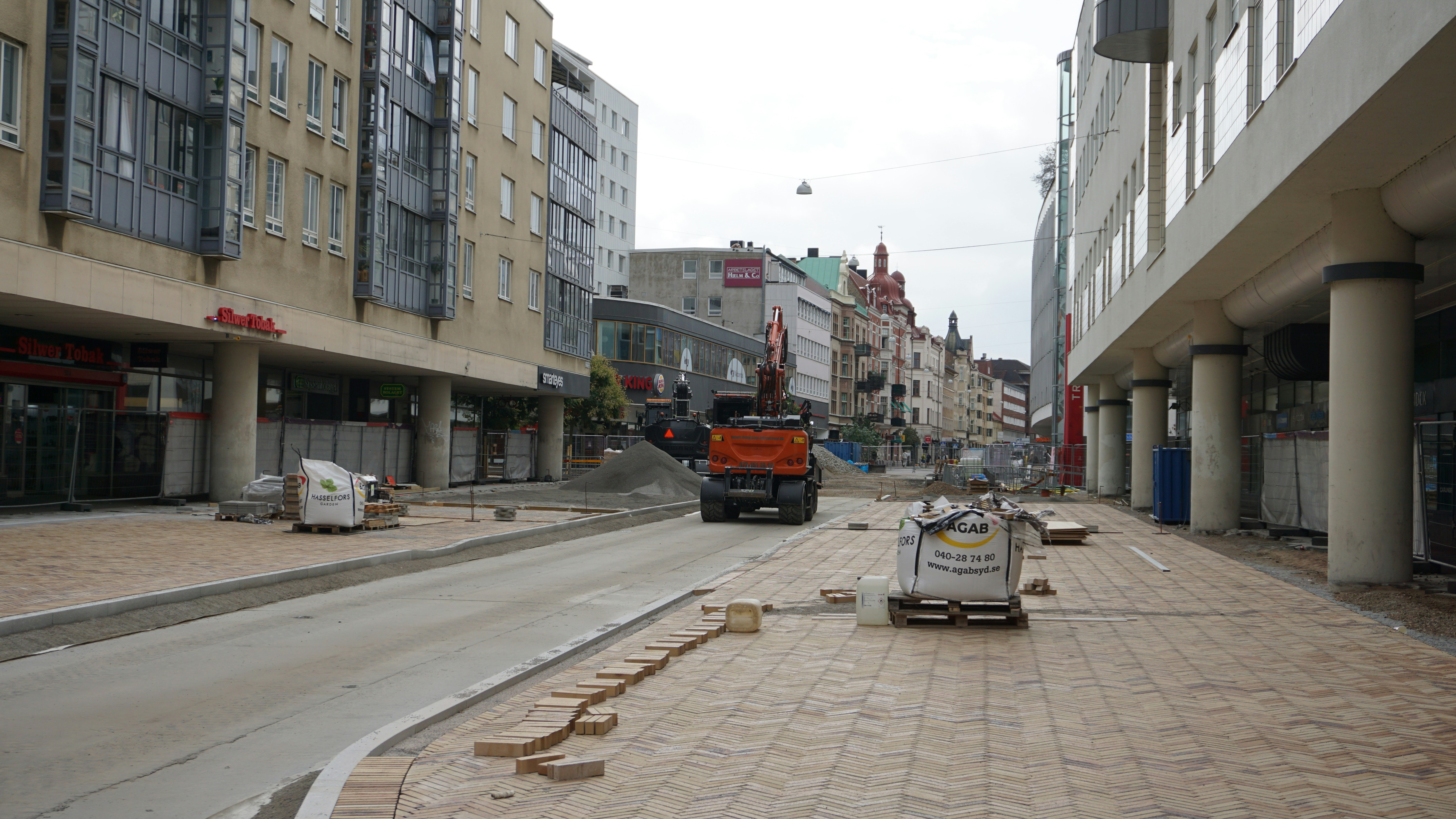 Urban Construction Corridor: Street Under Renovation with Machinery and Far Avenues